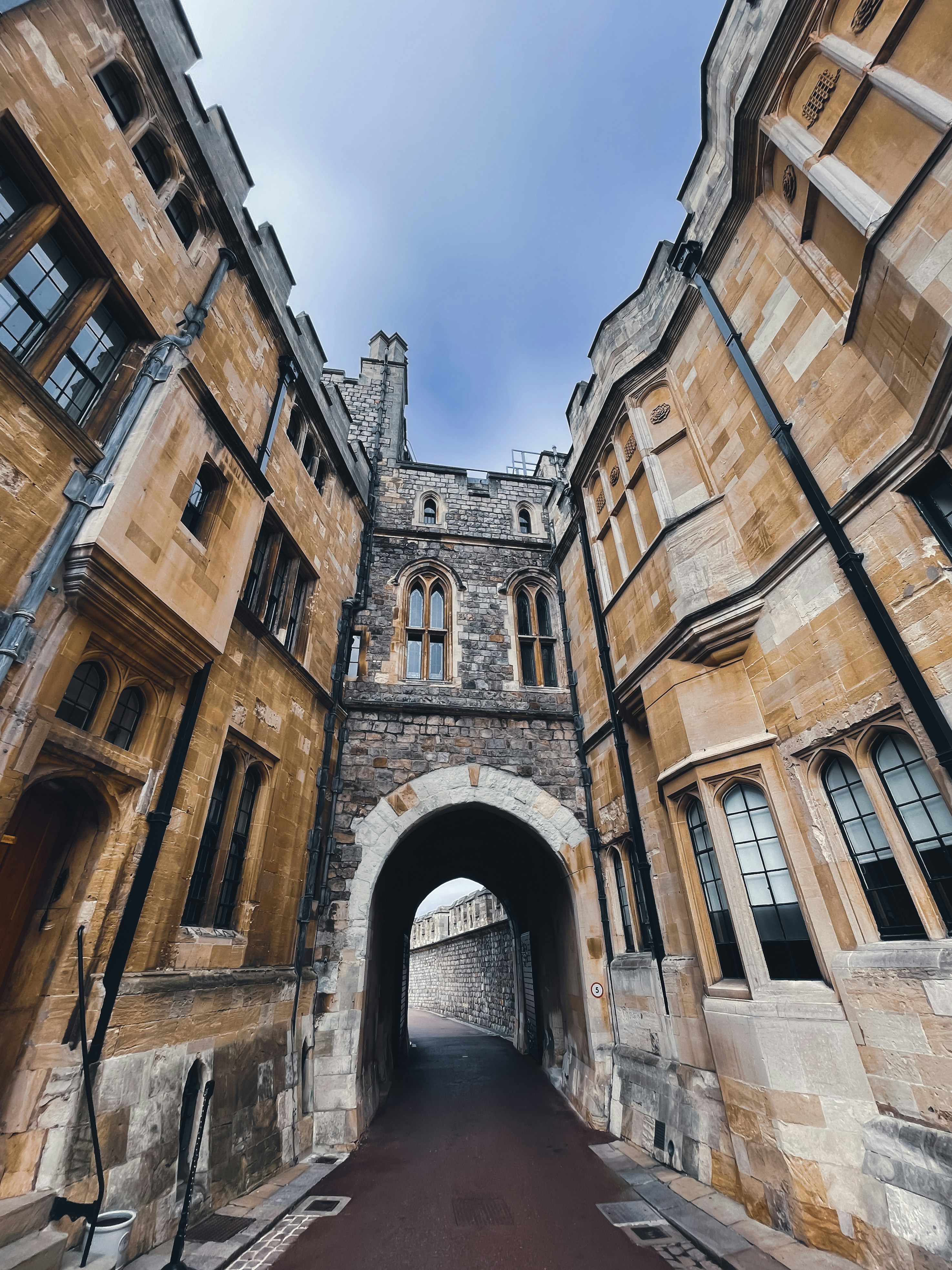 A very old looking building with a big arch photo – Free Building Image ...