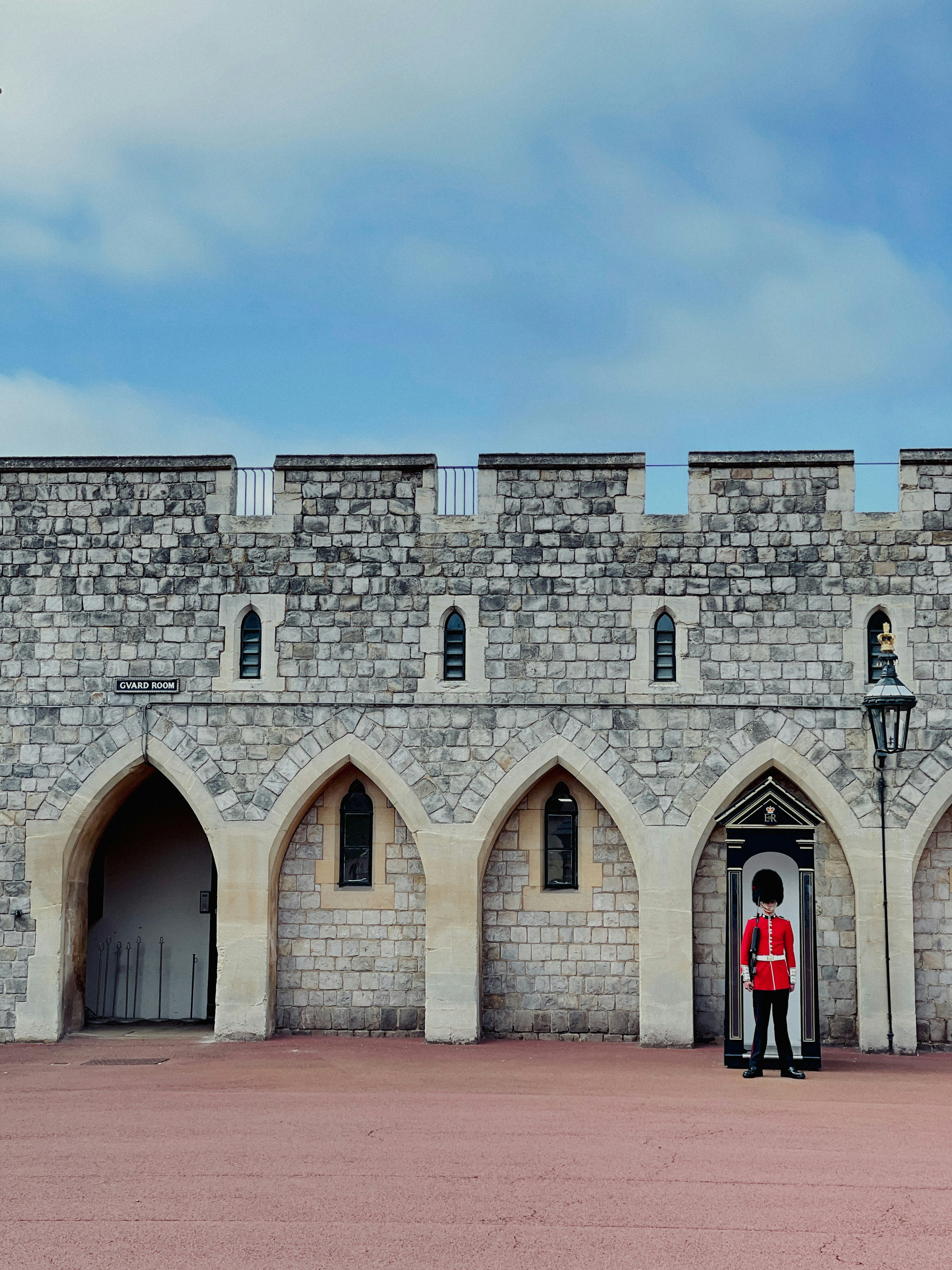 Guard at the Gate: A Royal Entrance by Stone Arches