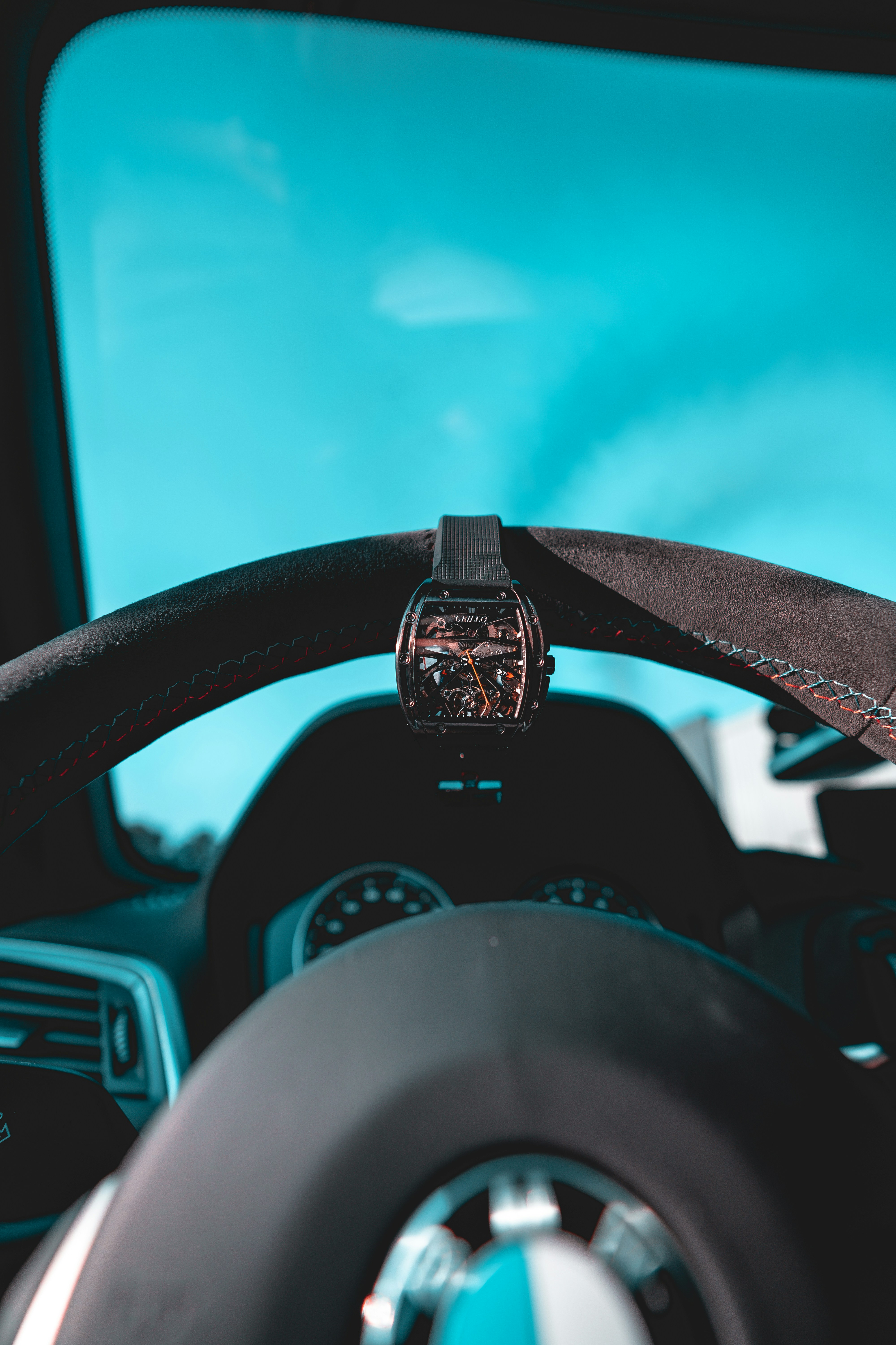 Chronometer on the Wheel: A Close-Up Portrait of Time in a Car Cockpit
