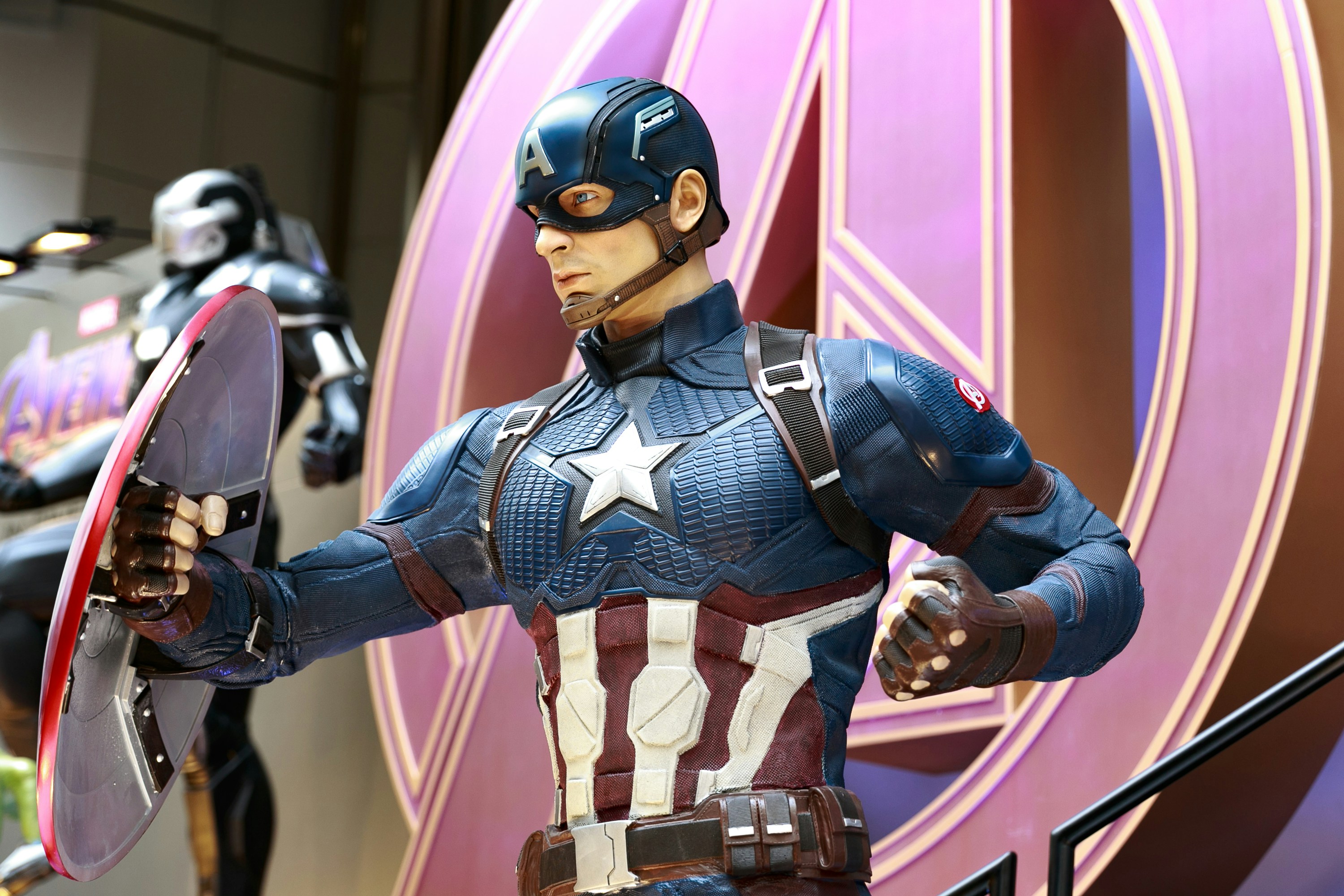 A statue of captain america holding a shield photo – Free Human Image ...