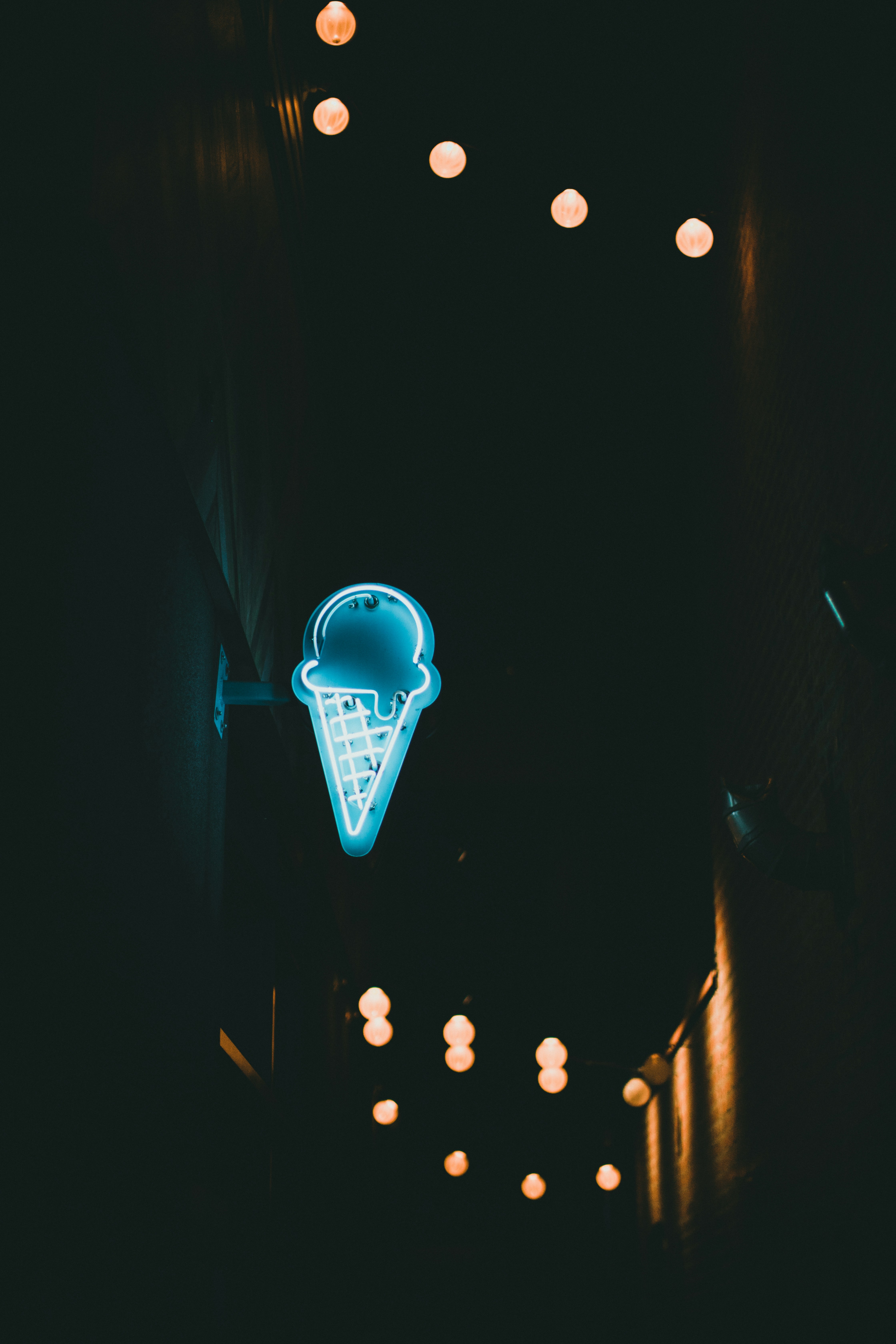 Neon Ice Cream Sign Drifting Through a Dark Alley