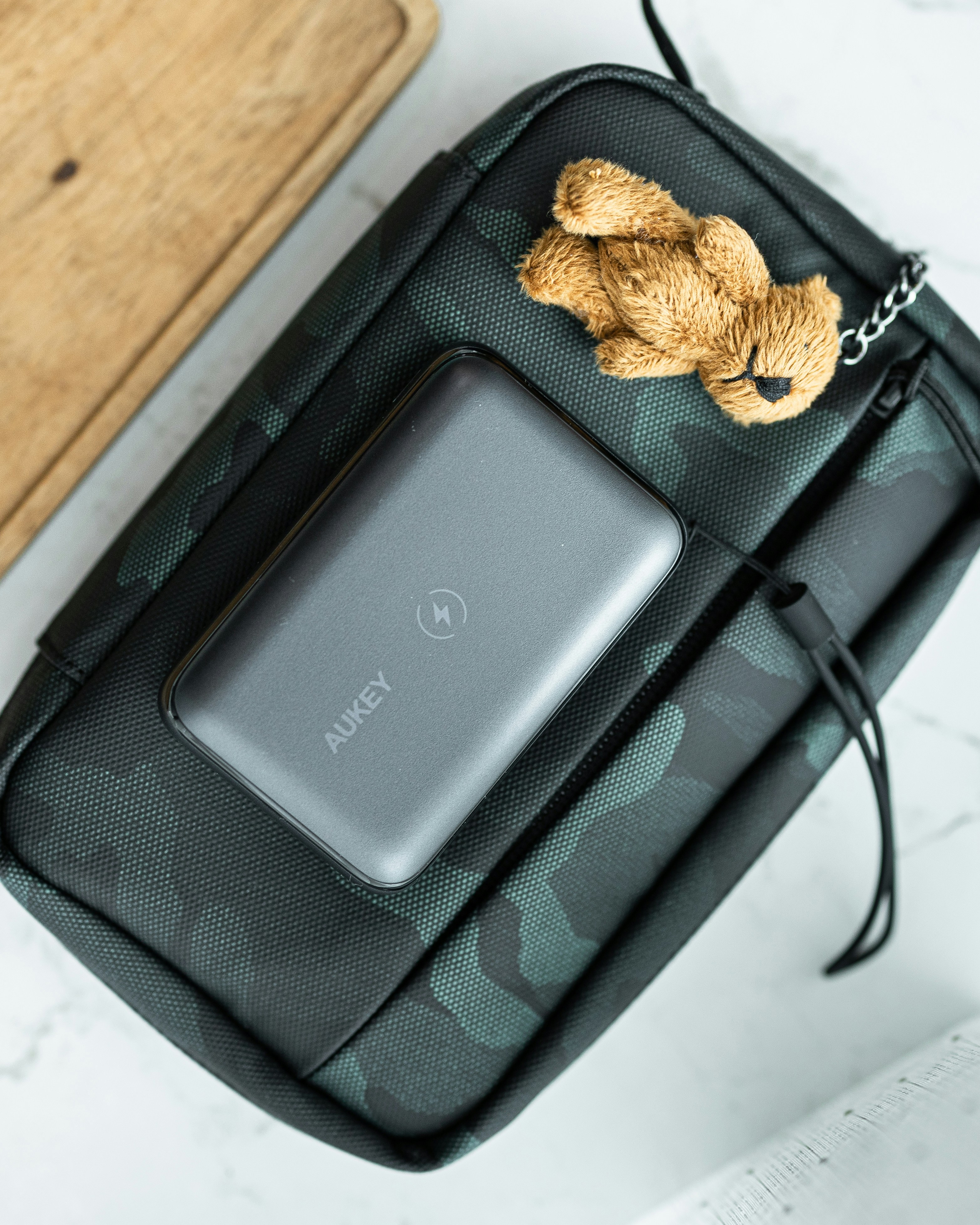 a cell phone sitting on top of a backpack