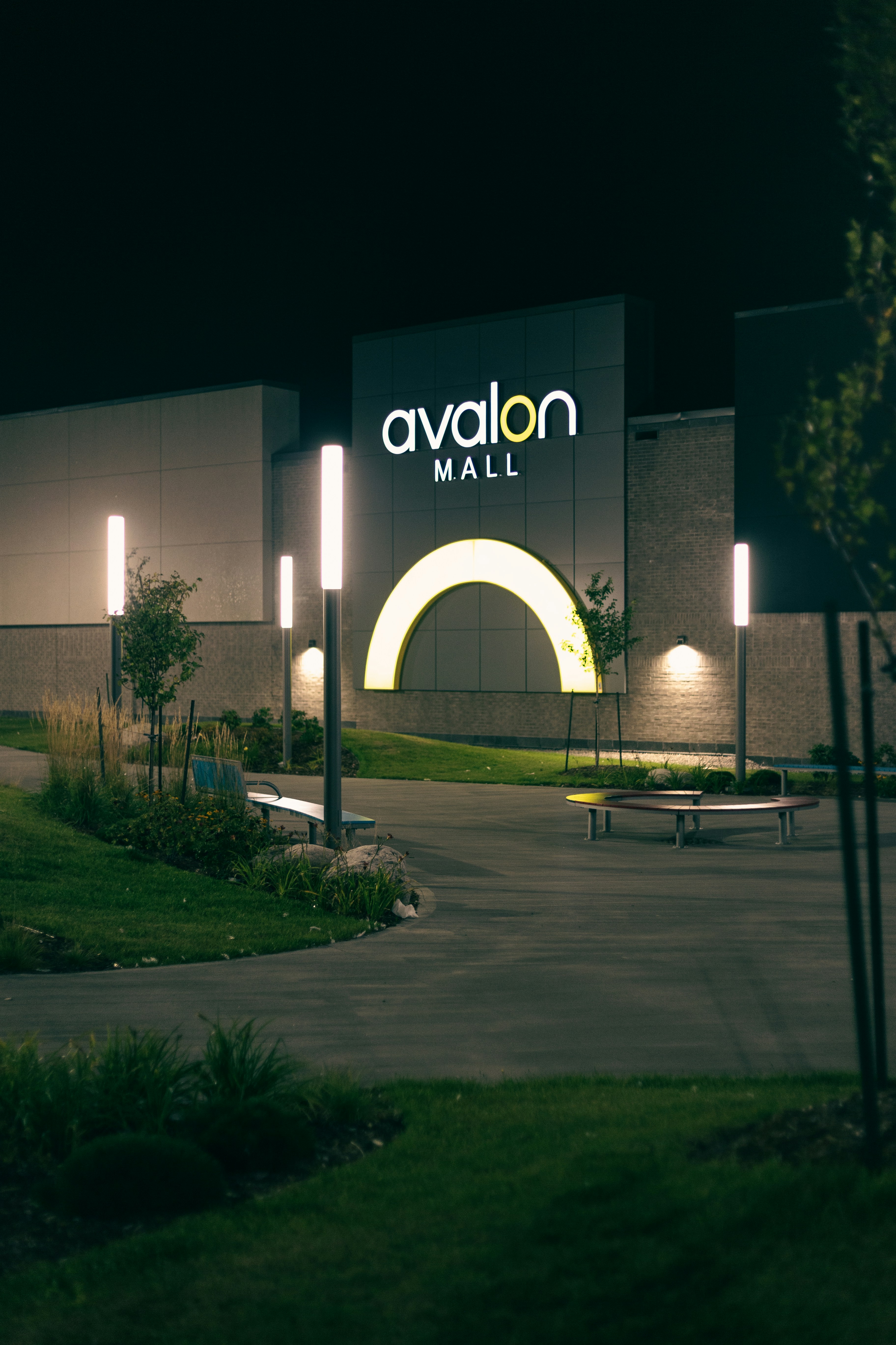 A building with a sign that says avalon mall photo – Free Grey Image on ...
