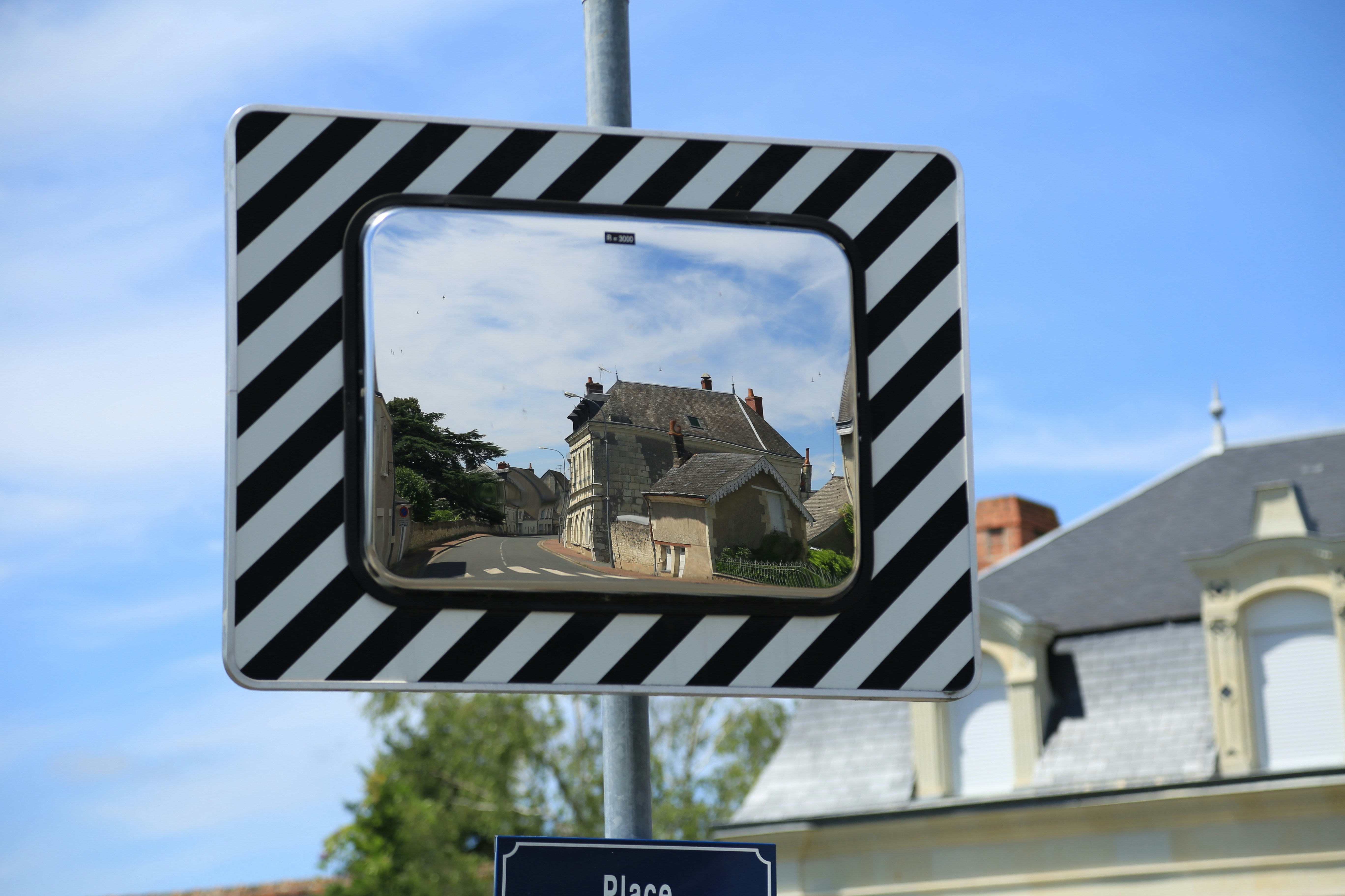 a reflection of a house in a mirror