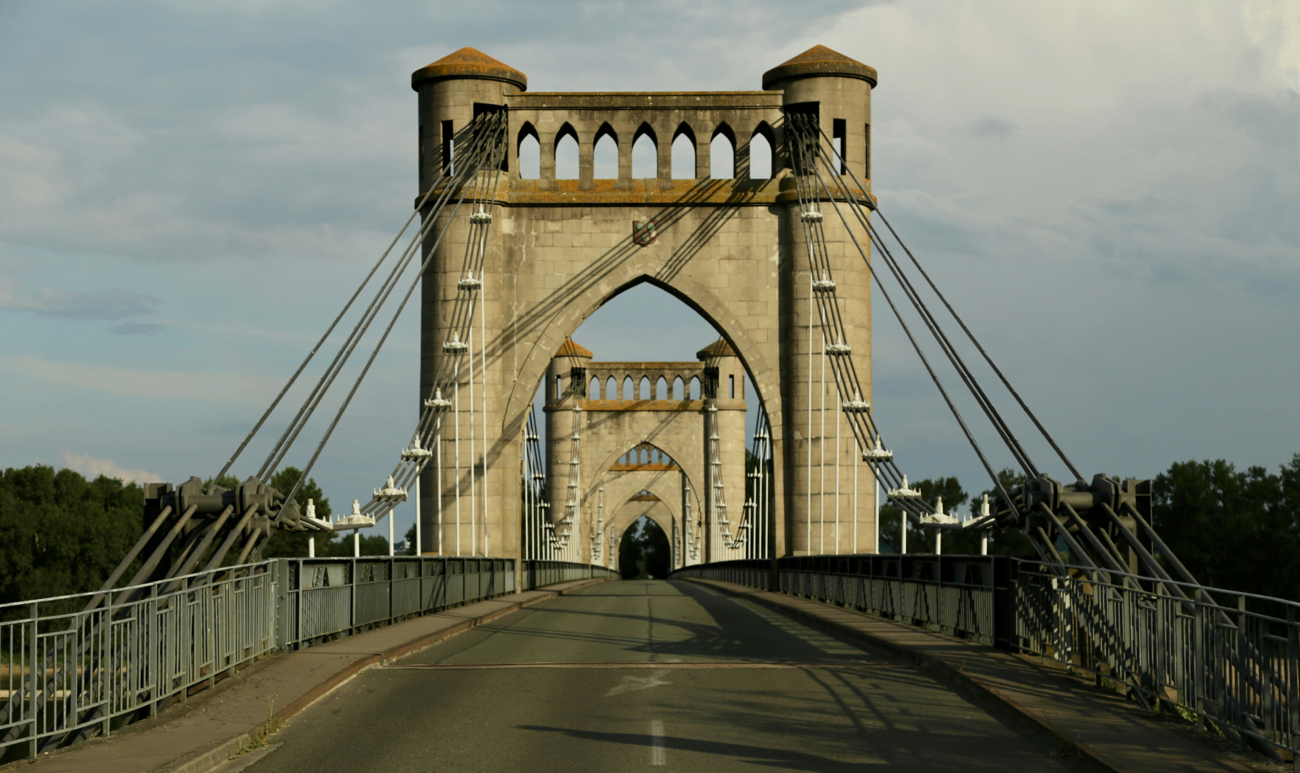 A very tall bridge spanning over a river photo – Free Building Image on ...