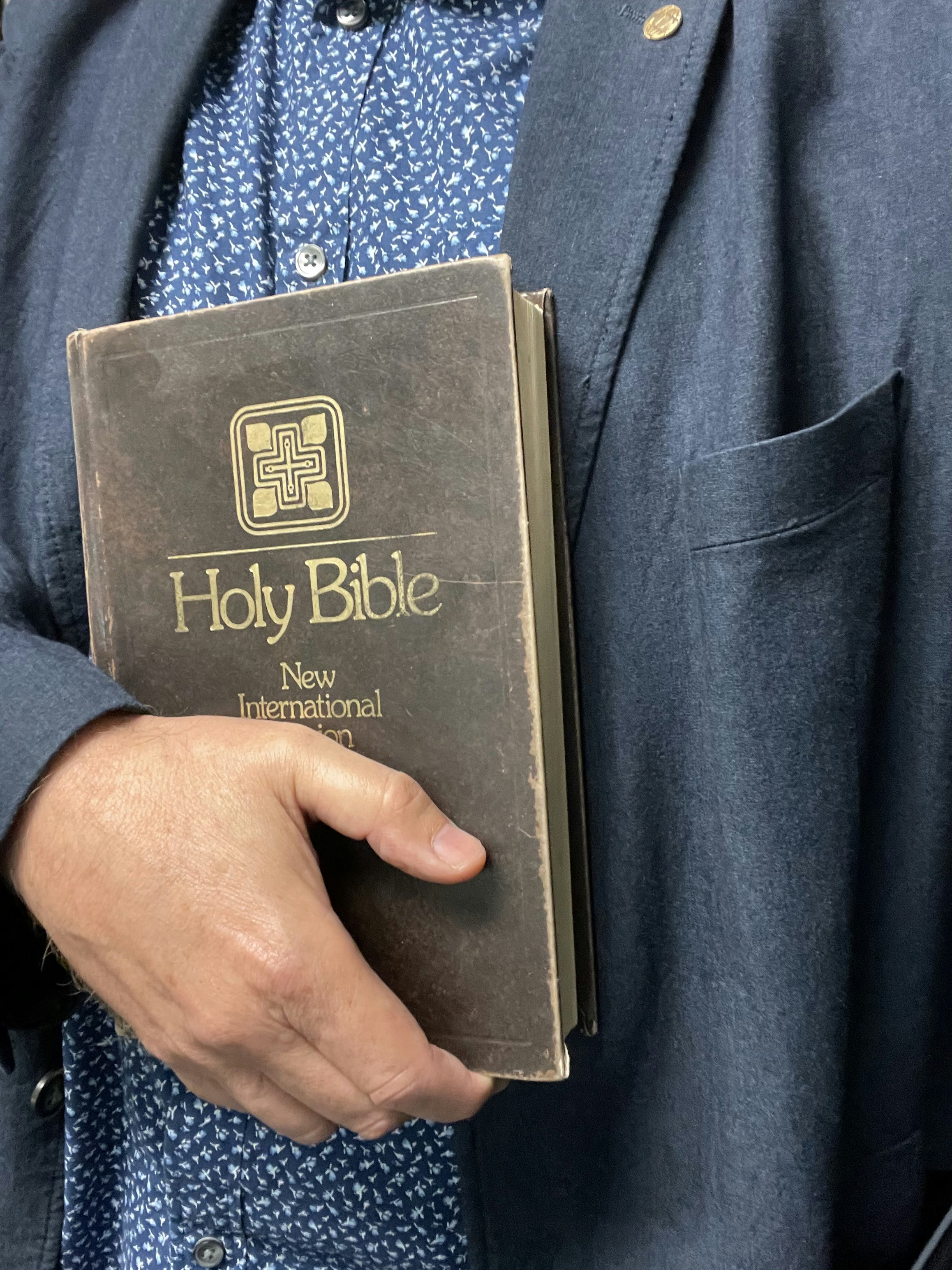 A man holding a bible in his hands photo – Free Bible Image on Unsplash