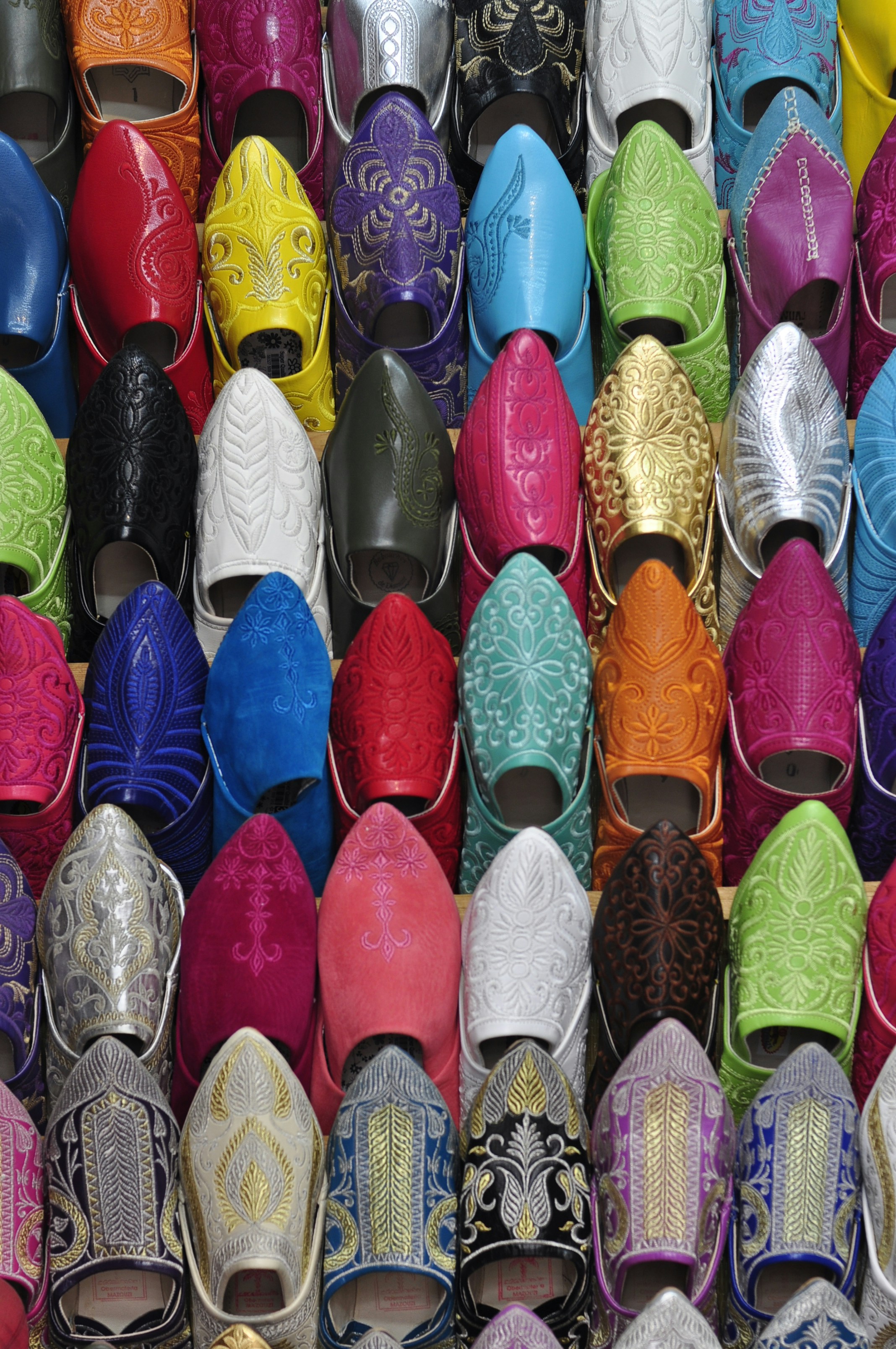 a pile of colorful shoes sitting next to each other