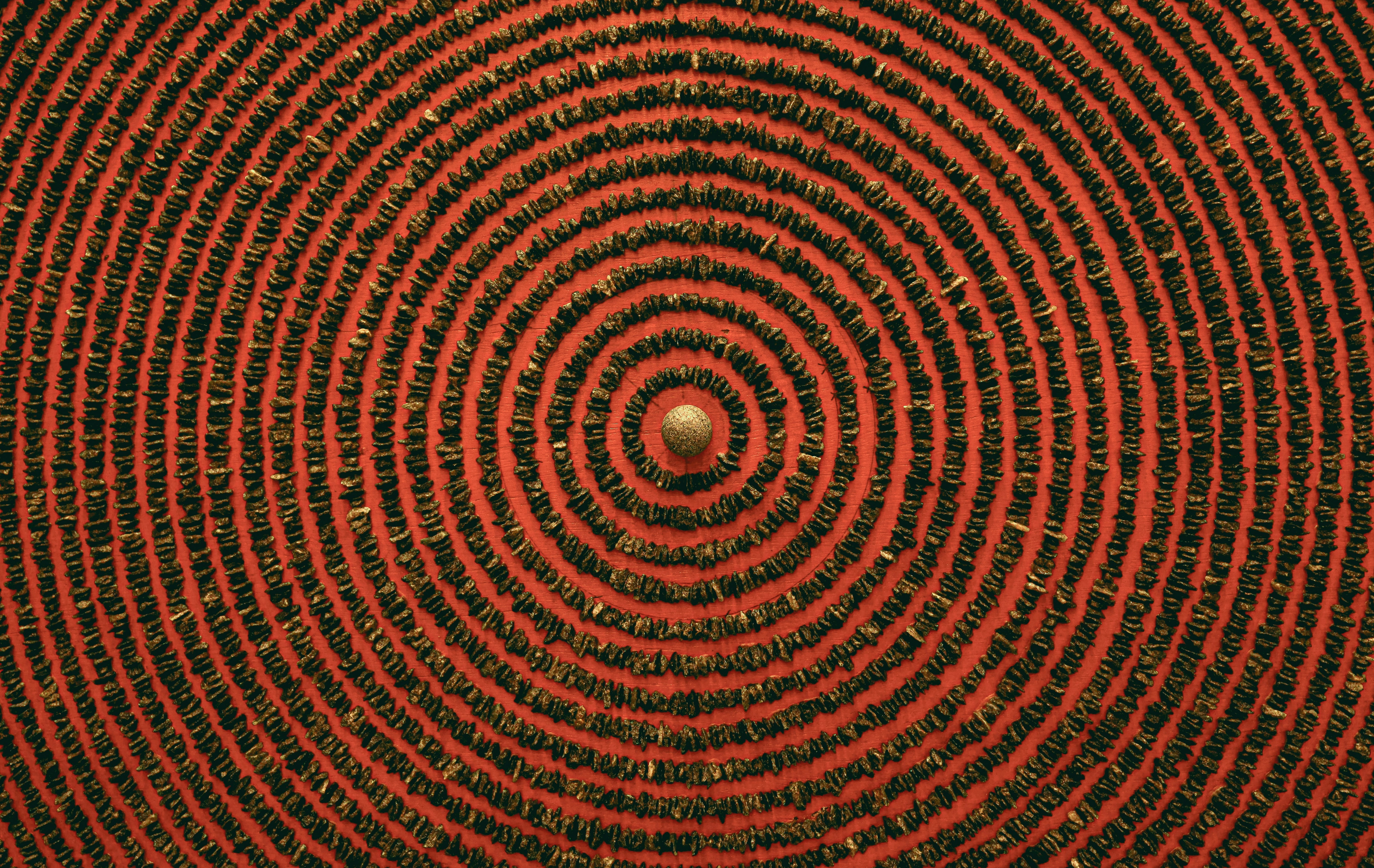 A red and black background with a circular design photo – Free Pattern ...