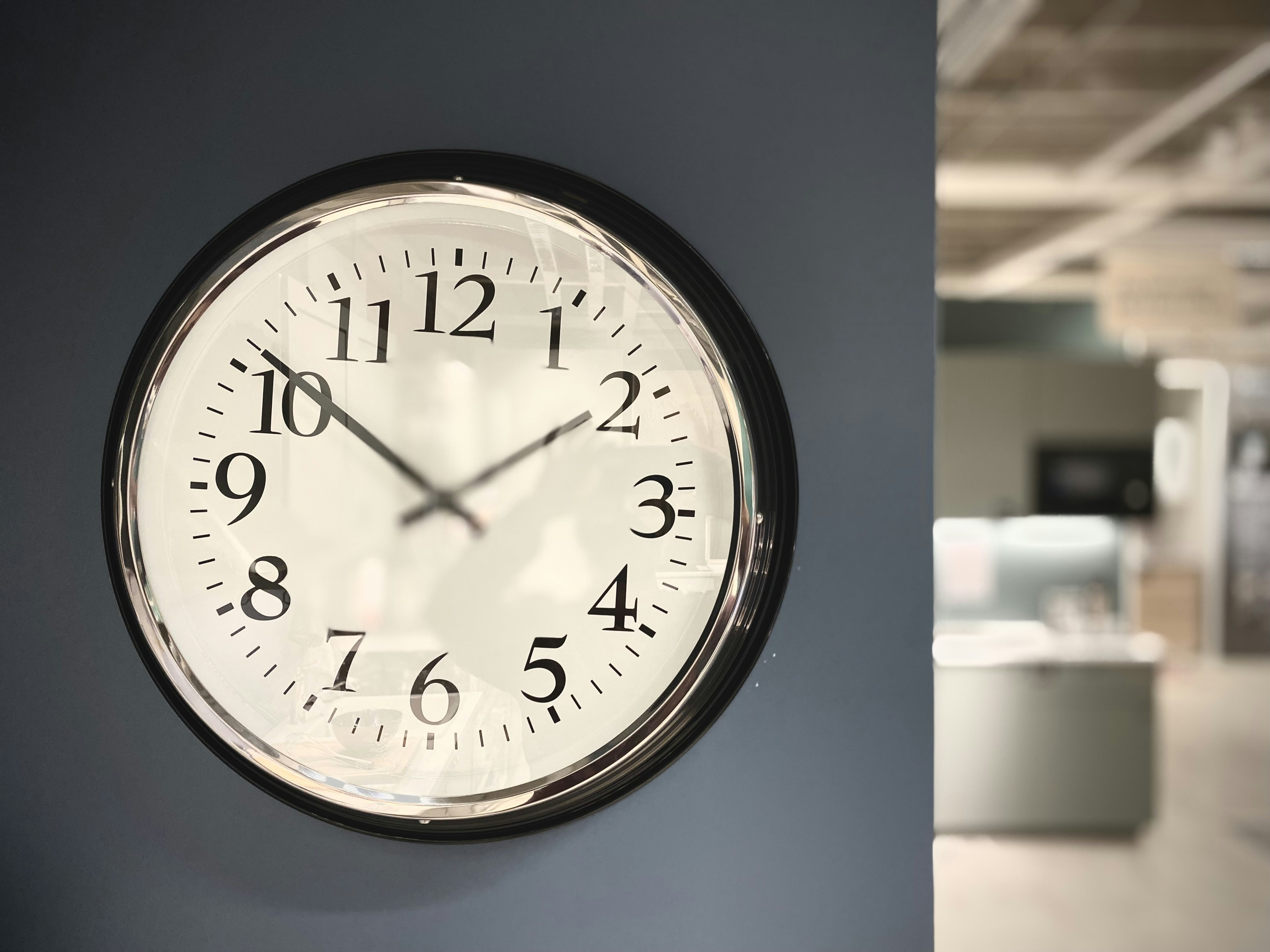 Slate-Blue Clock in a Soft-Focus Office Corridor