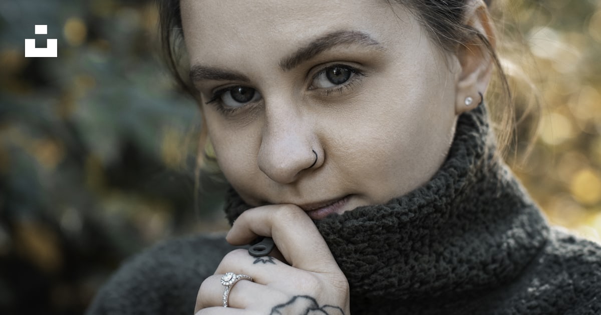 A Woman With A Tattoo On Her Arm Photo Free Grey Image On Unsplash