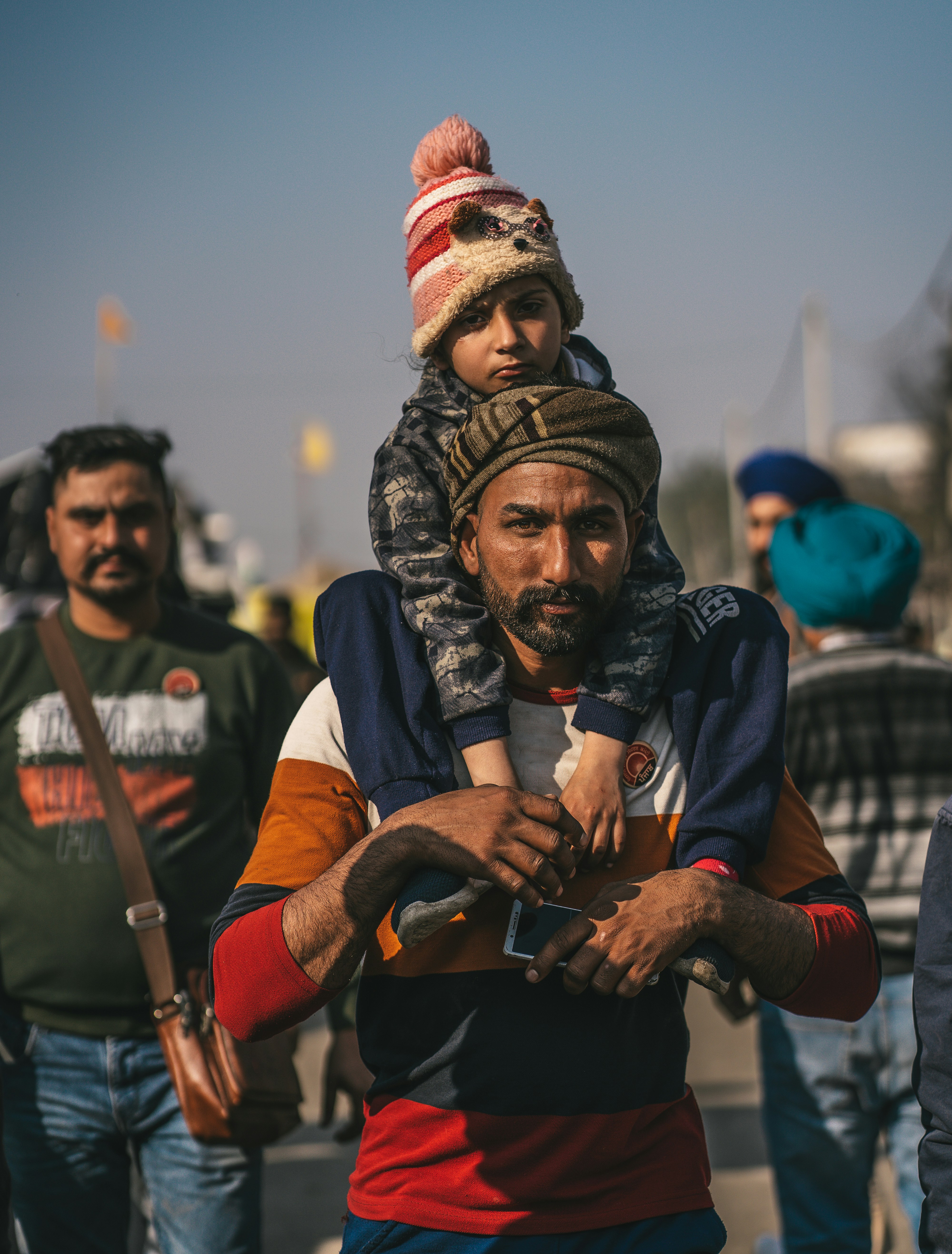 A man carrying a child on his shoulders photo – Free India Image on ...