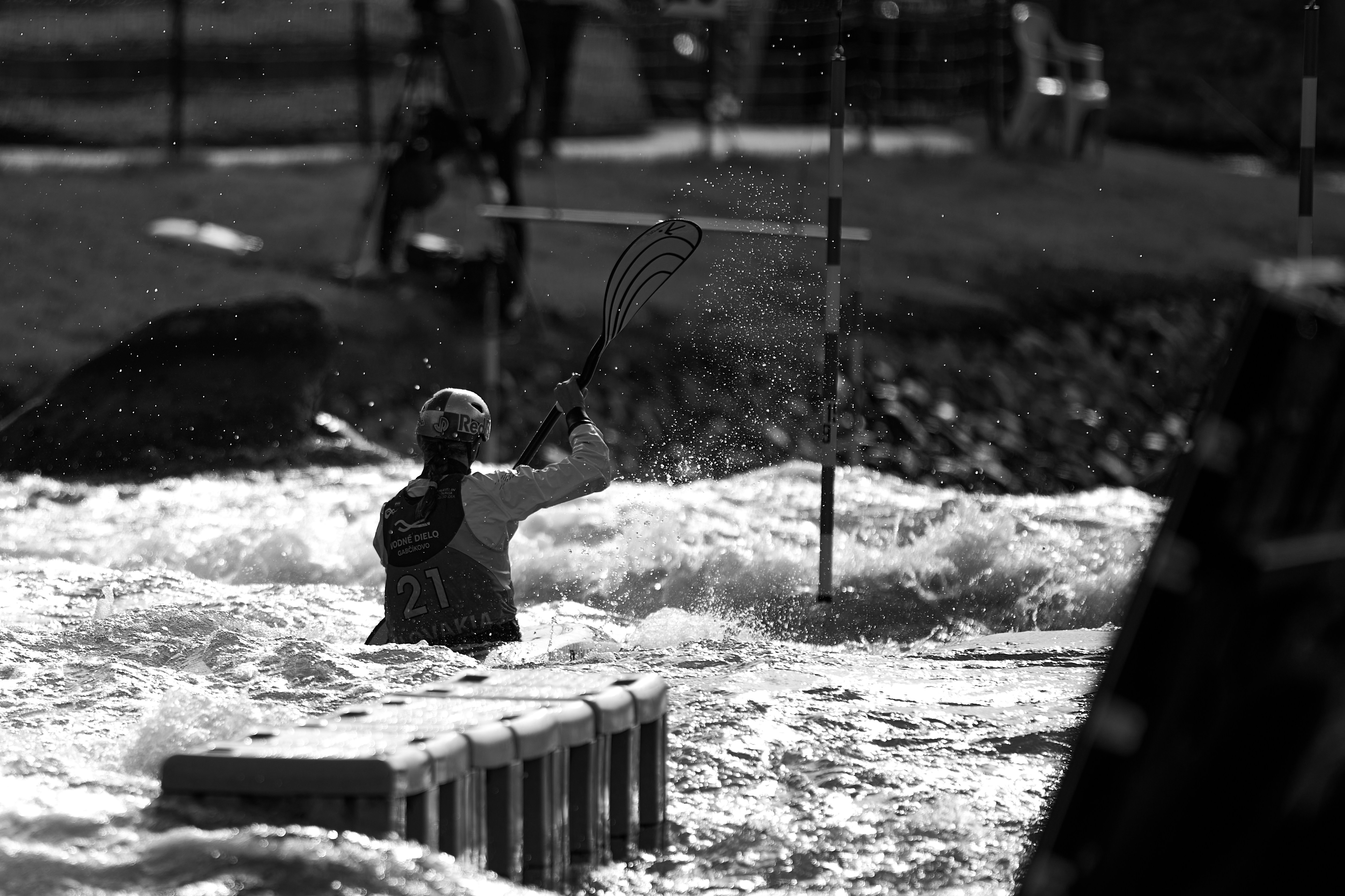 Paddling a Surge: Kayaker Commands the Whitewater Arc