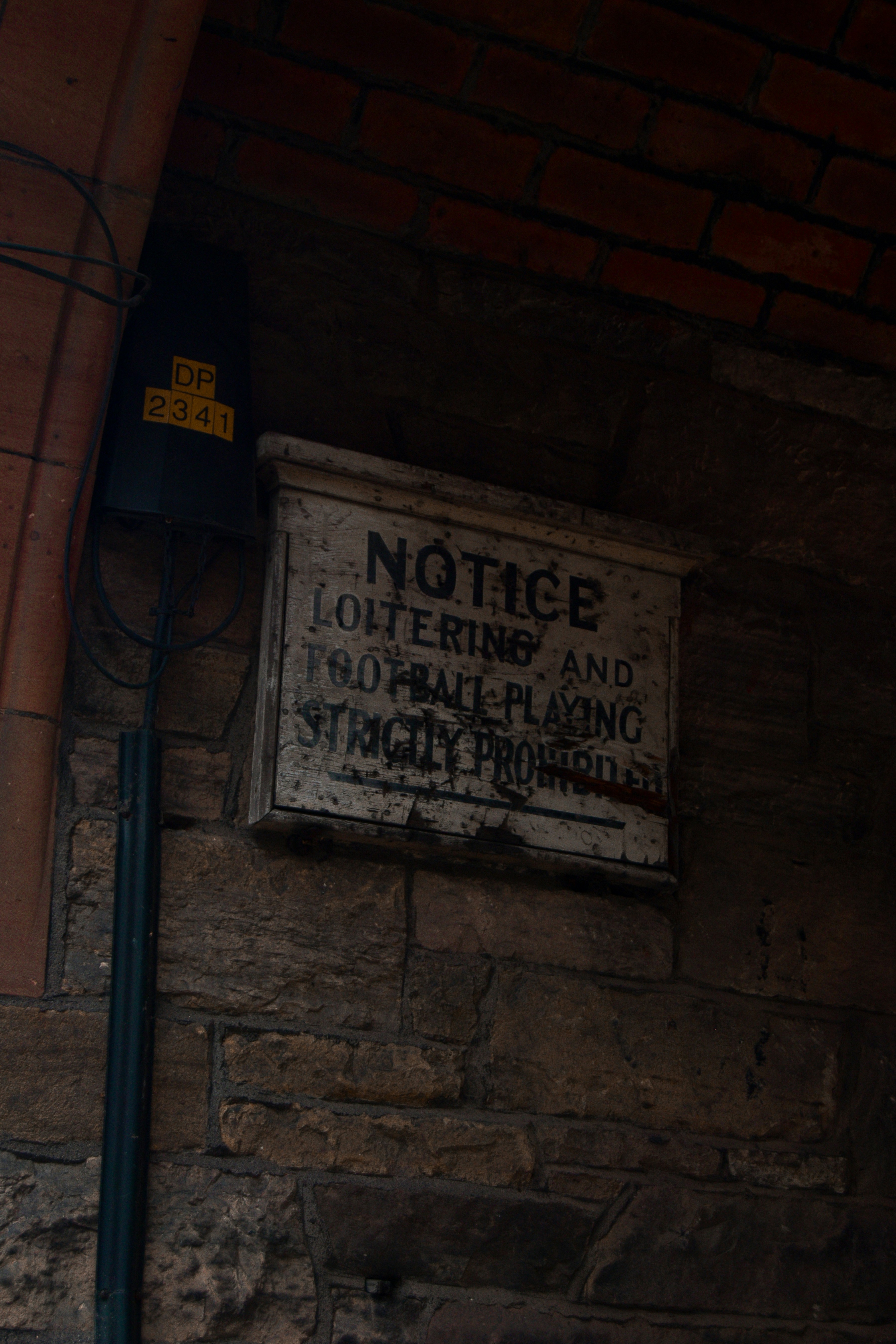 A sign on the side of a brick building photo – Free Scotland Image on ...