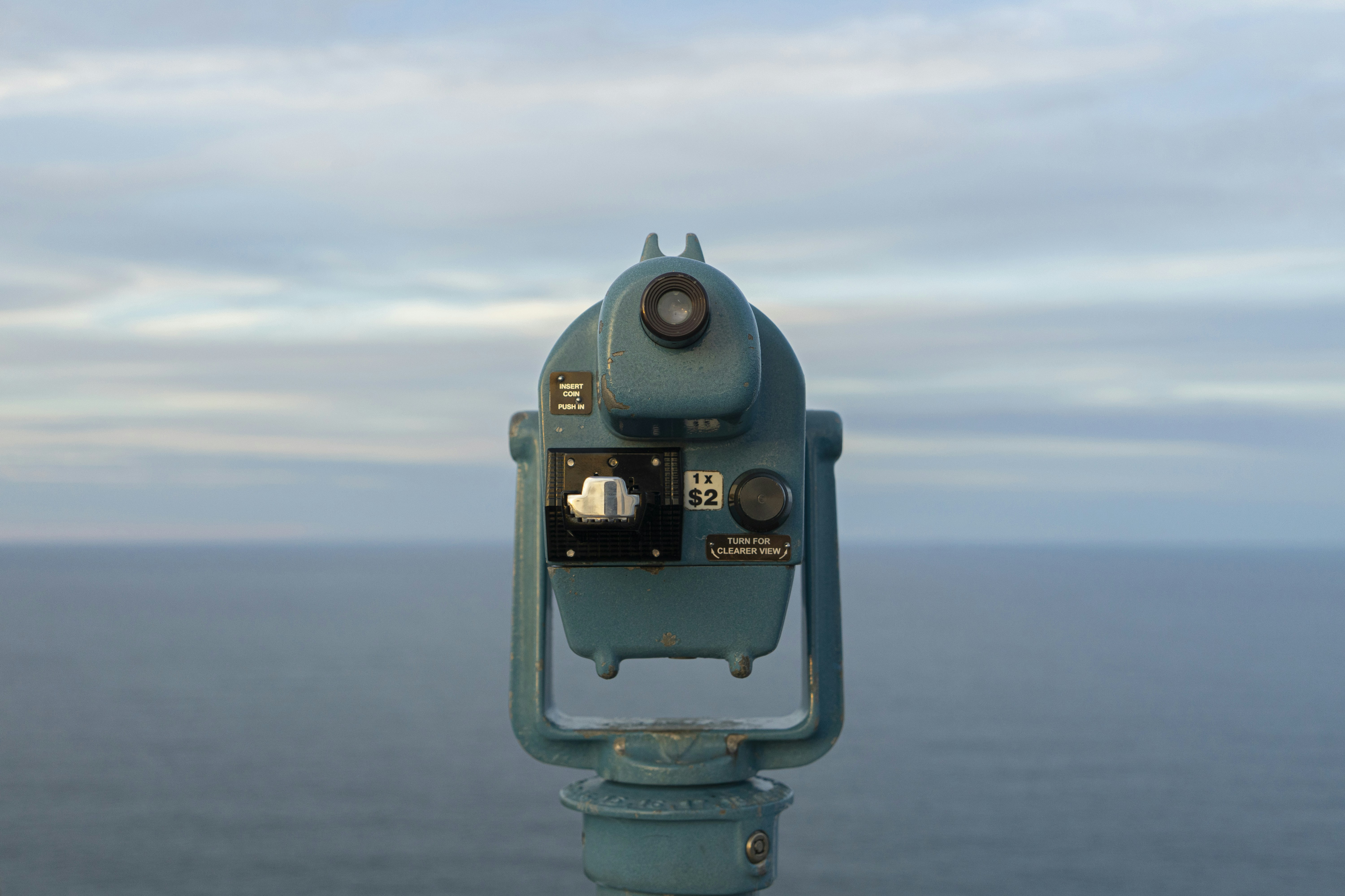 Turquoise Marine Binocular Viewer on a Distant Horizon