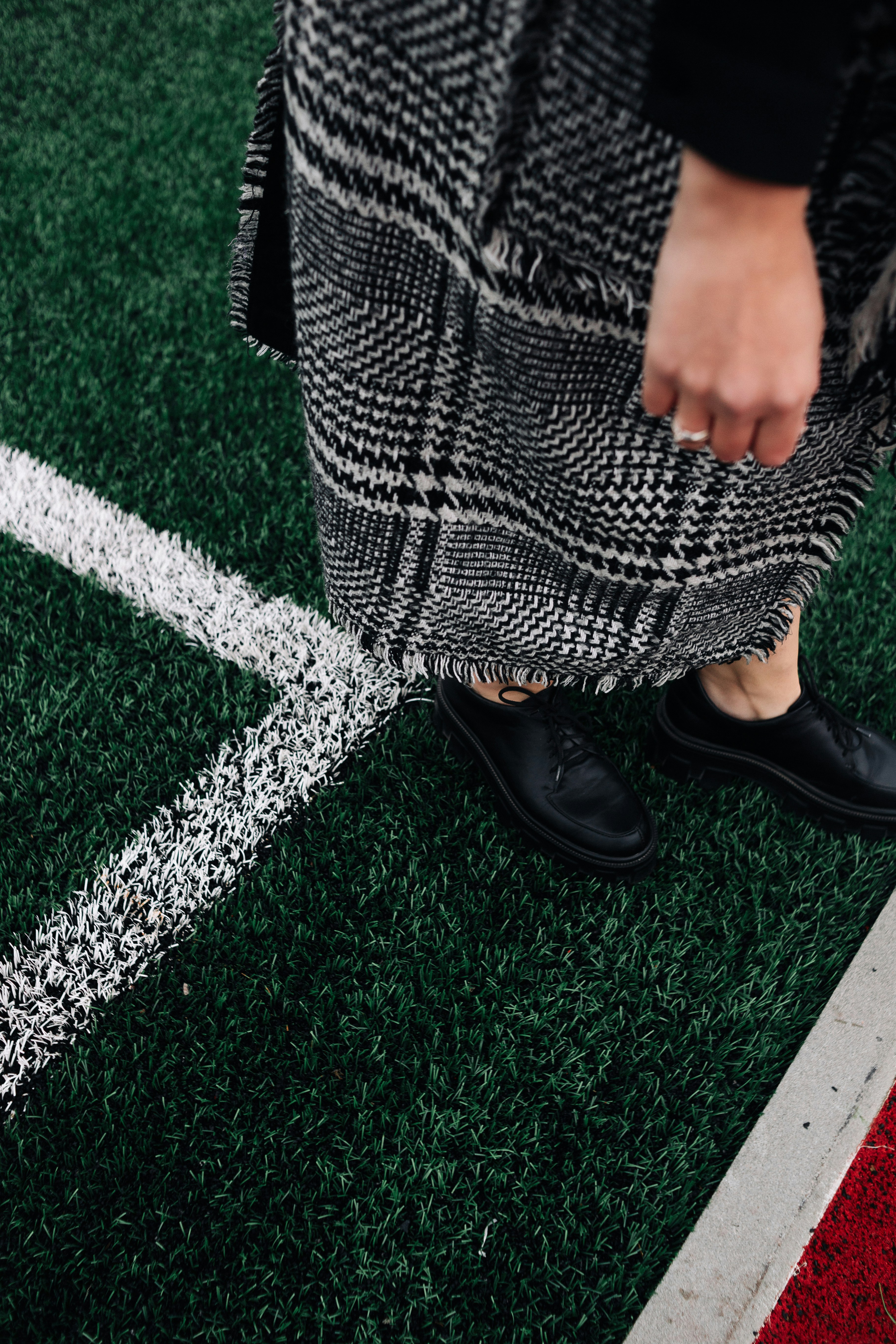 Crossing the Line: A Plaid Cloak at the Edge of the Turf