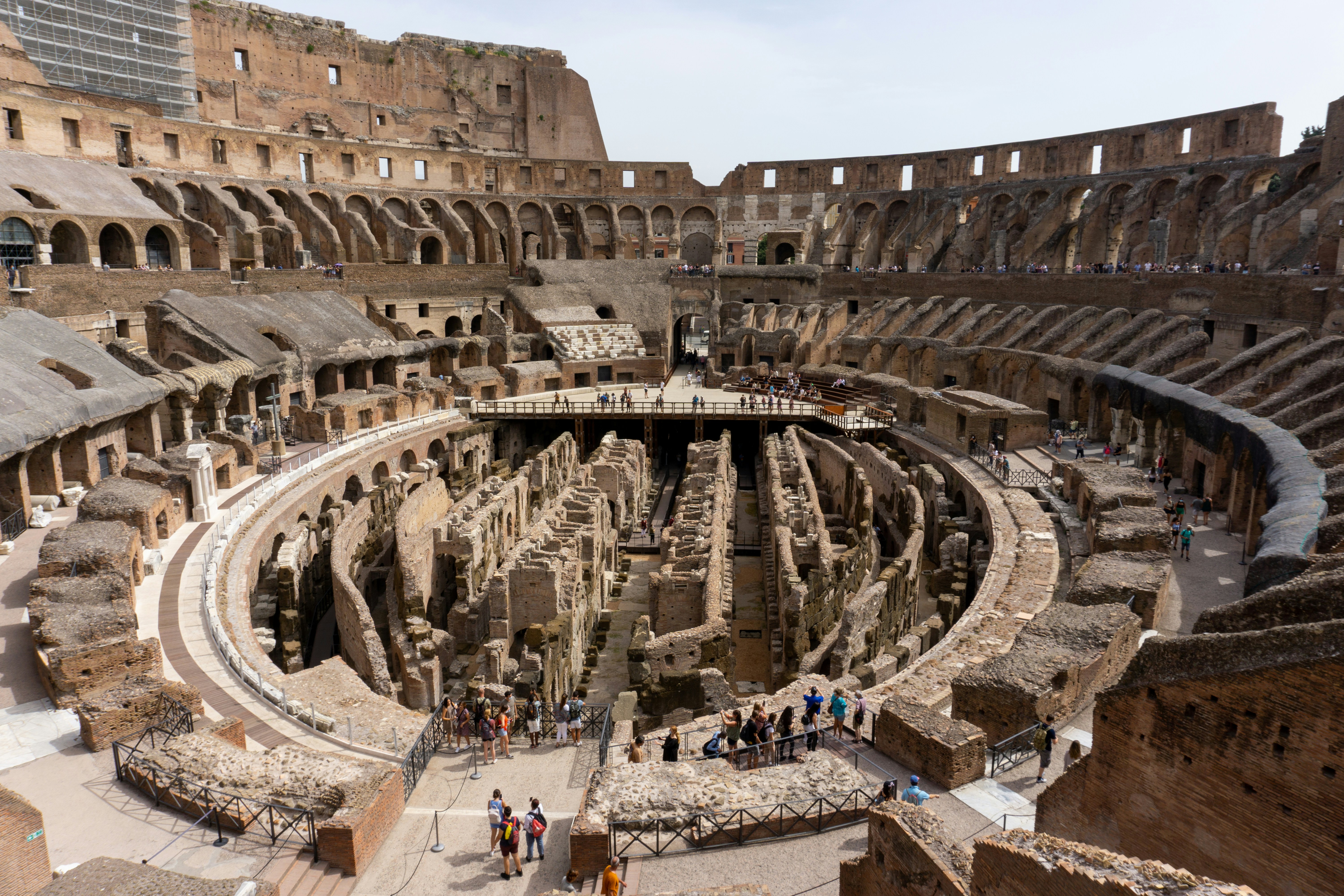 a group of people standing inside of an old building