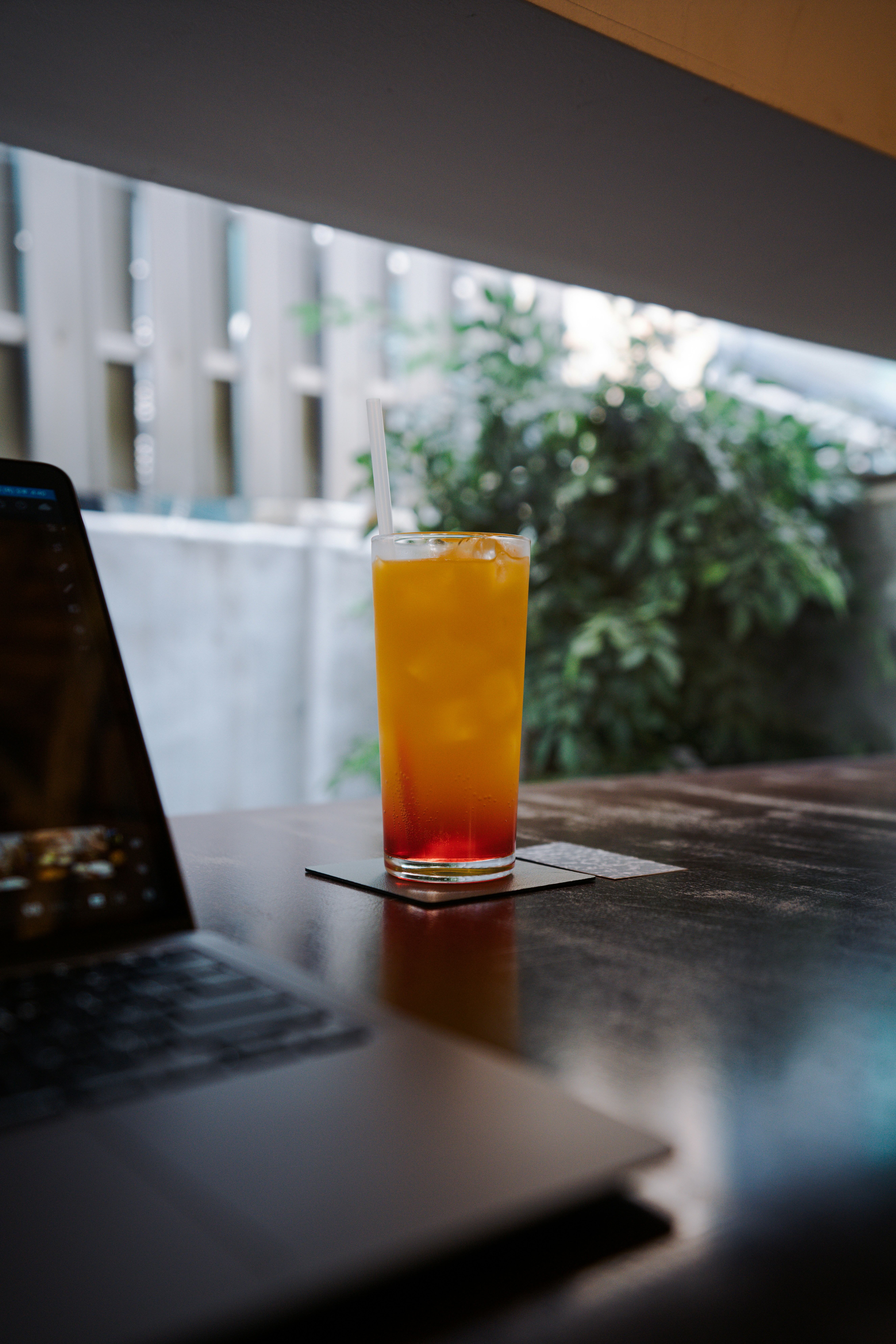 Juice on the Edge: A Dimly Lit Café Moment