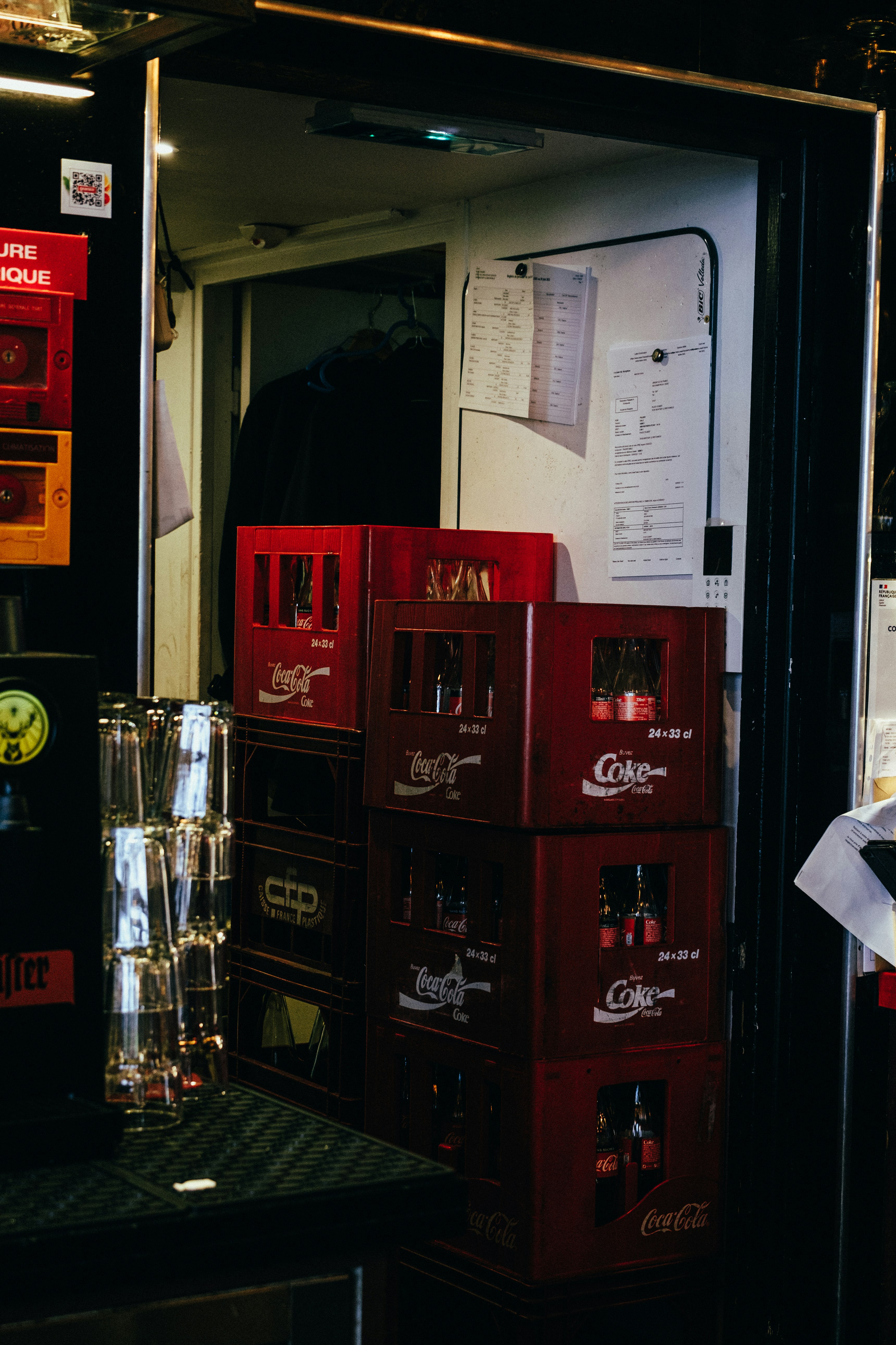 Coca-Cola Crates at a Dim Bar Entrance