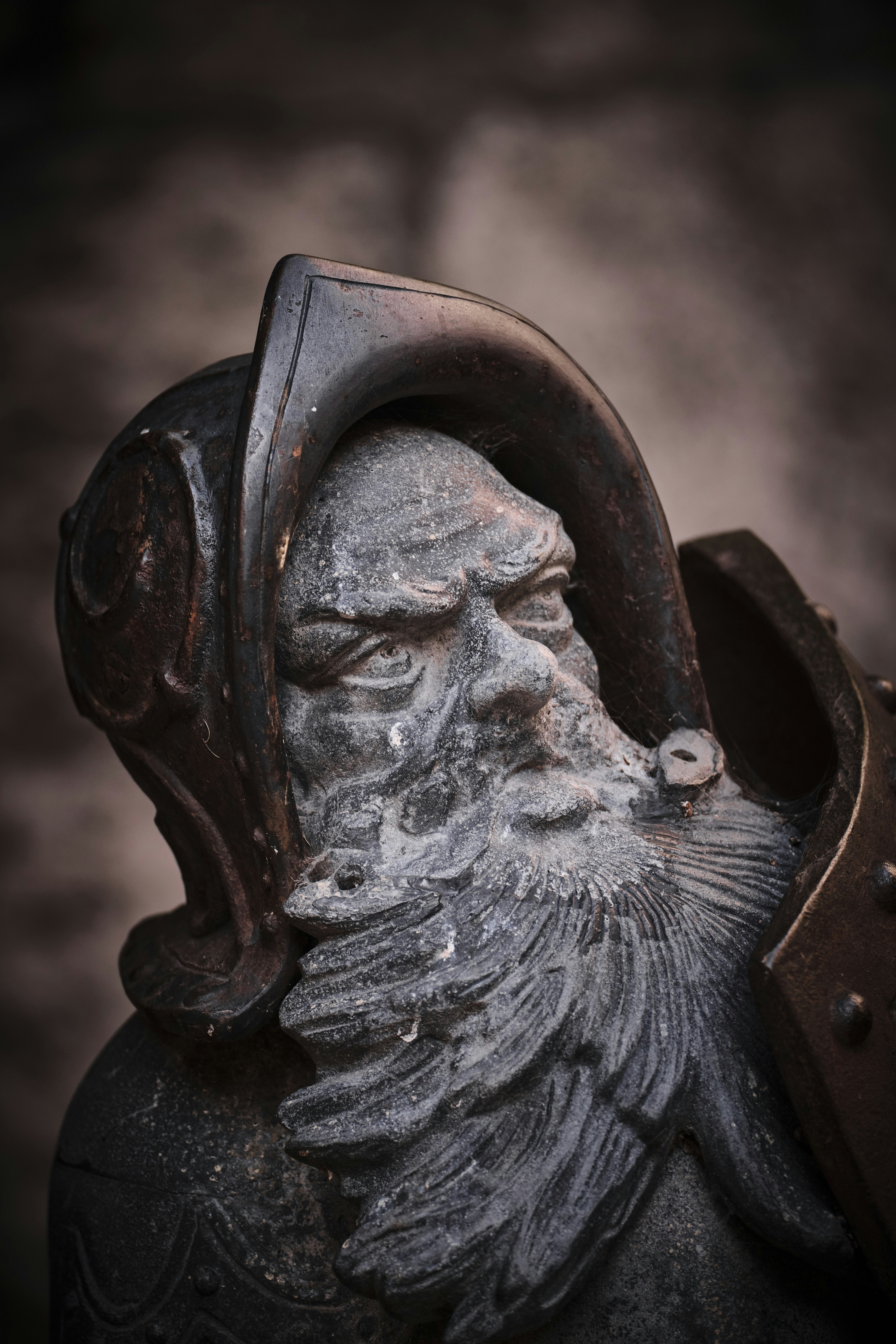 Iron Sage in the Fog: Weathered Helmeted Figure Guards the Dust
