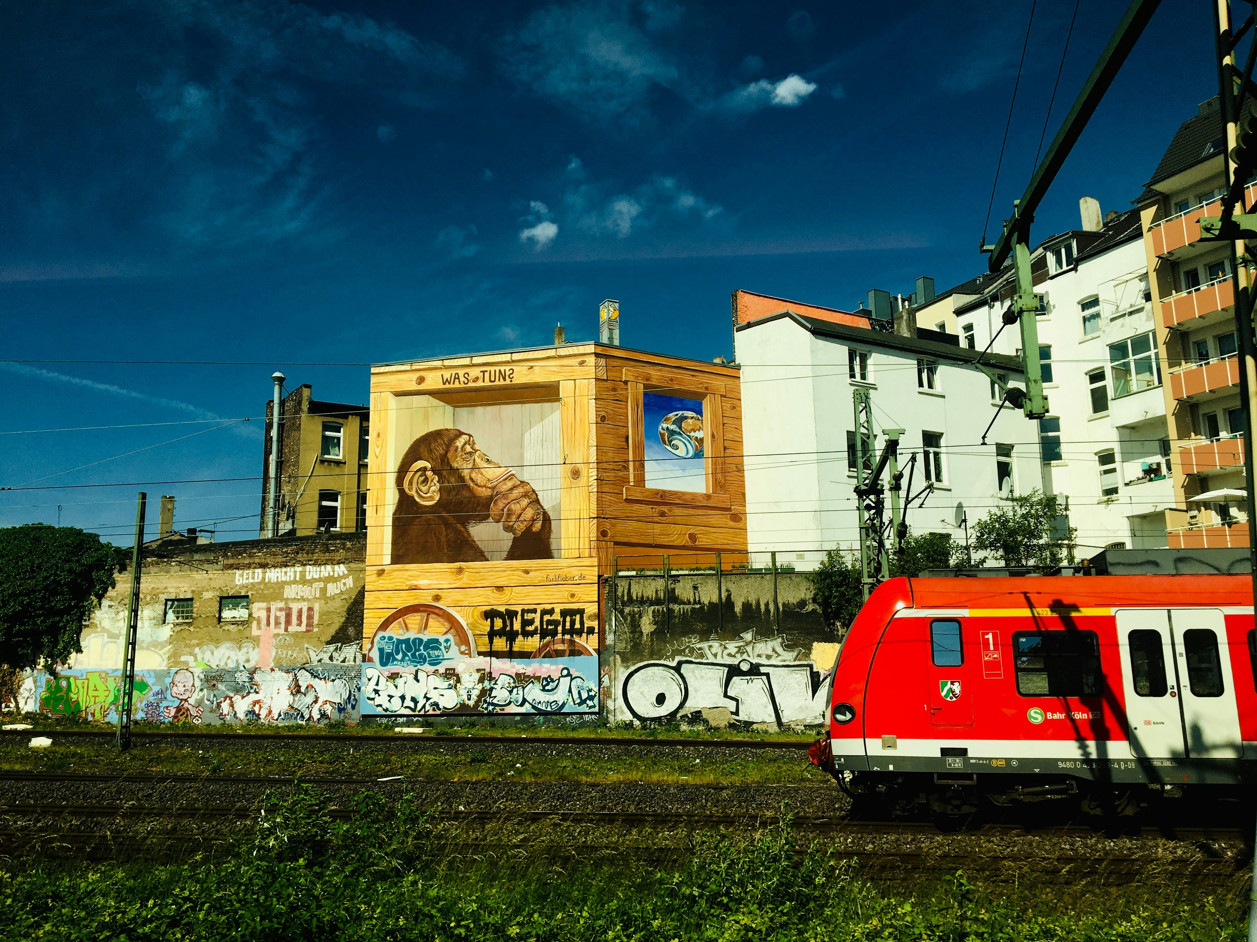 Graffited Industrial Facade Meets Red Commuter