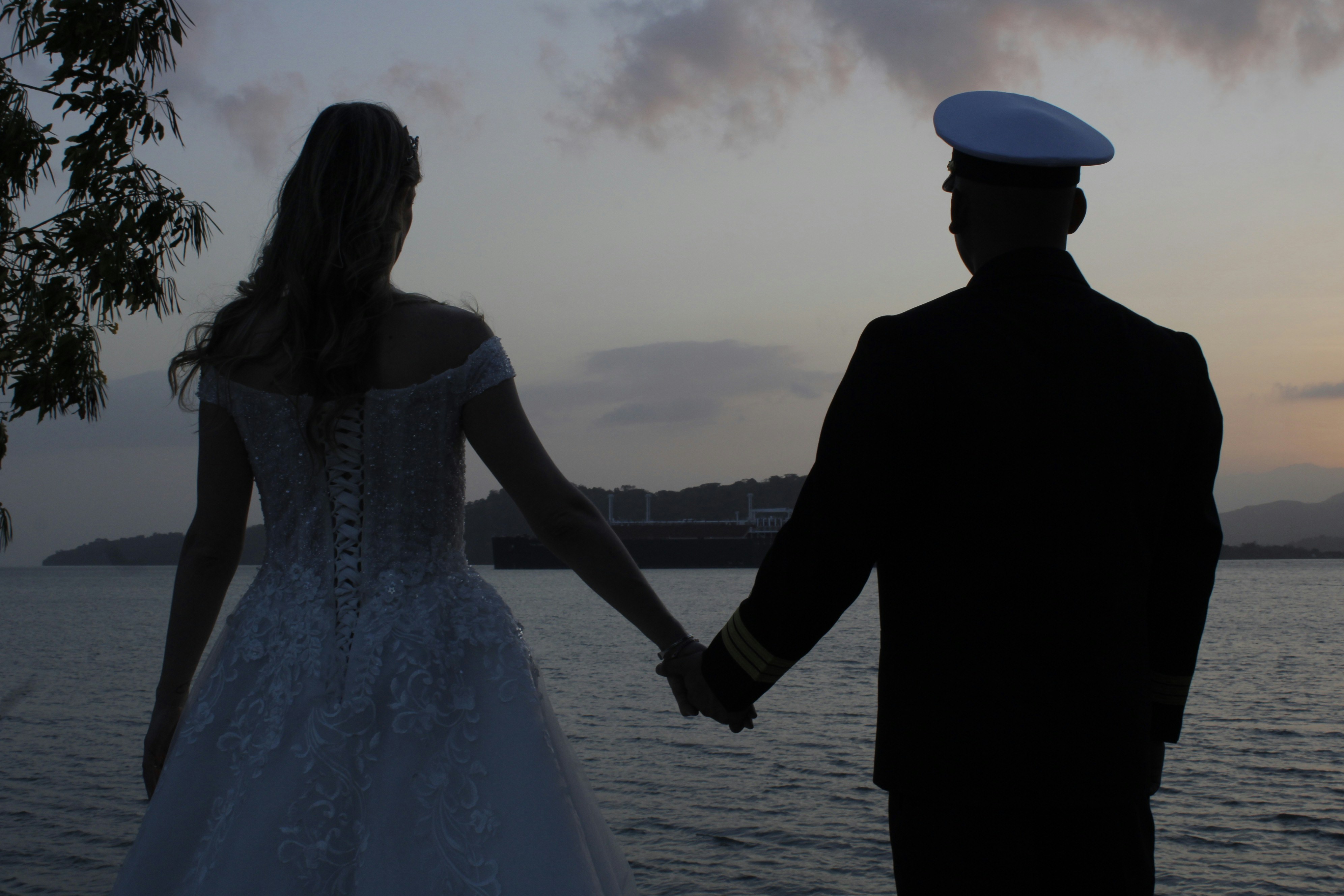 Dusk Vow by the Water: Hands Joined Under Quiet Skies
