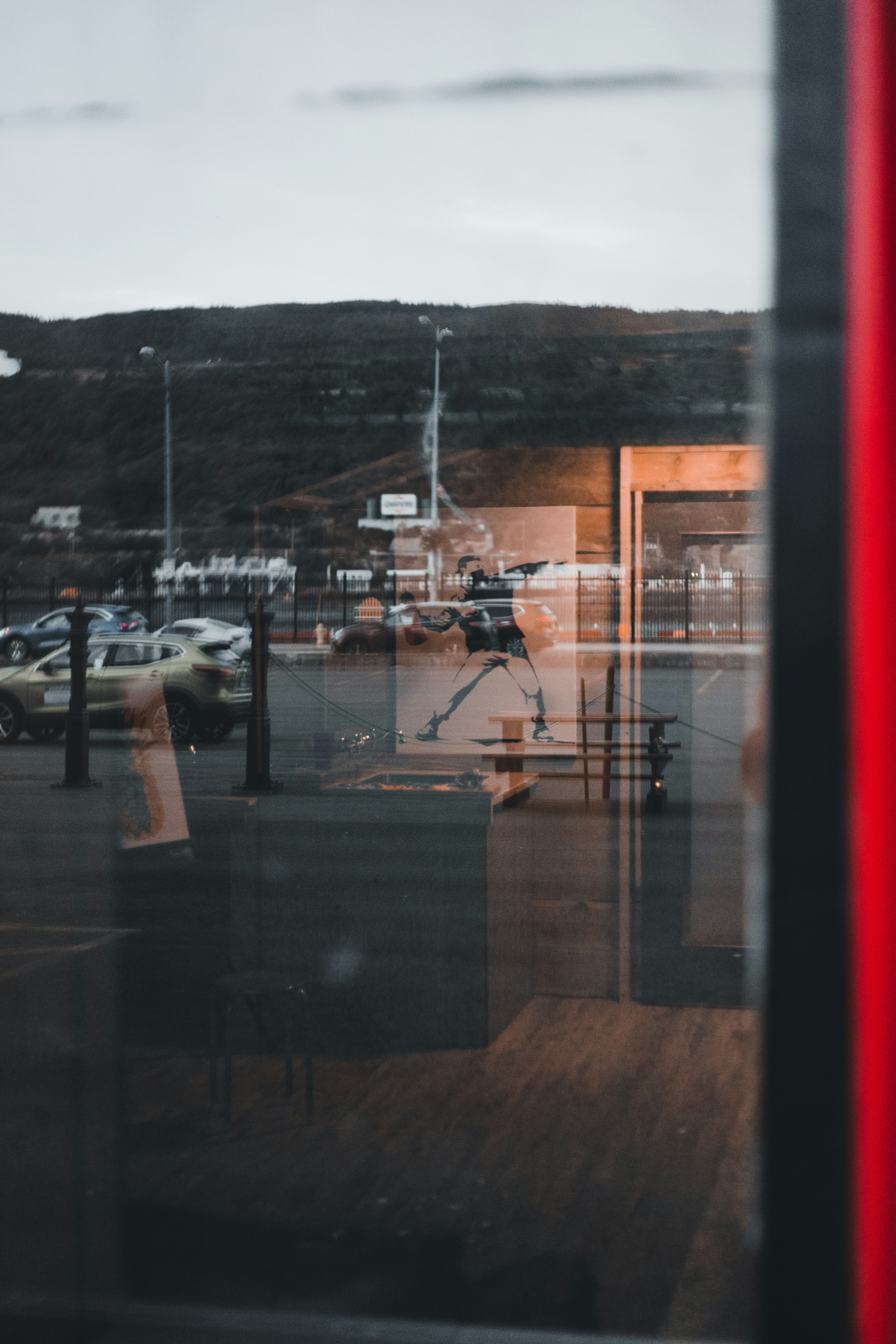 A view of a parking lot through a window photo – Free Flooring Image on ...