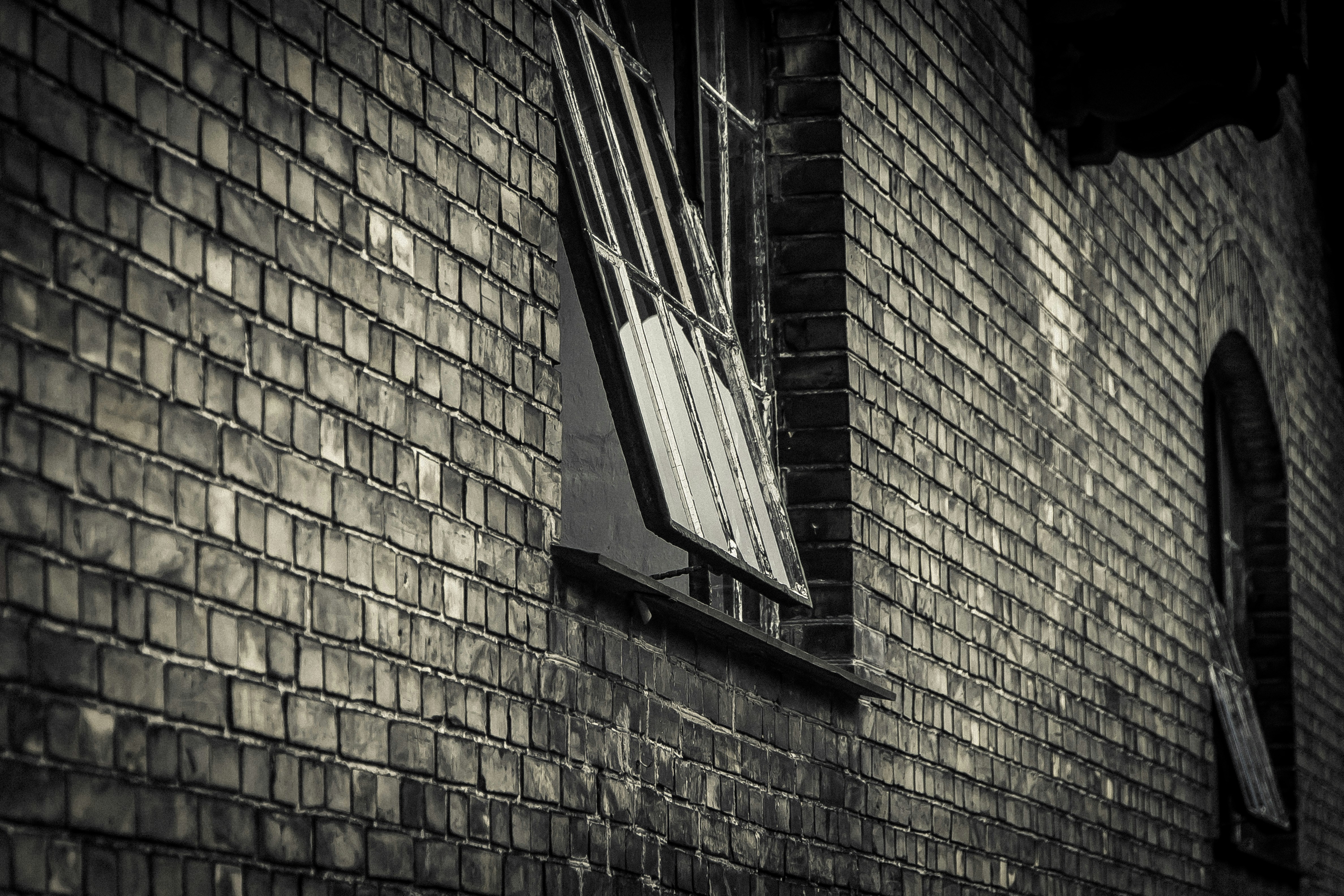 A brick wall with a window and a window pane photo – Free Window Image ...
