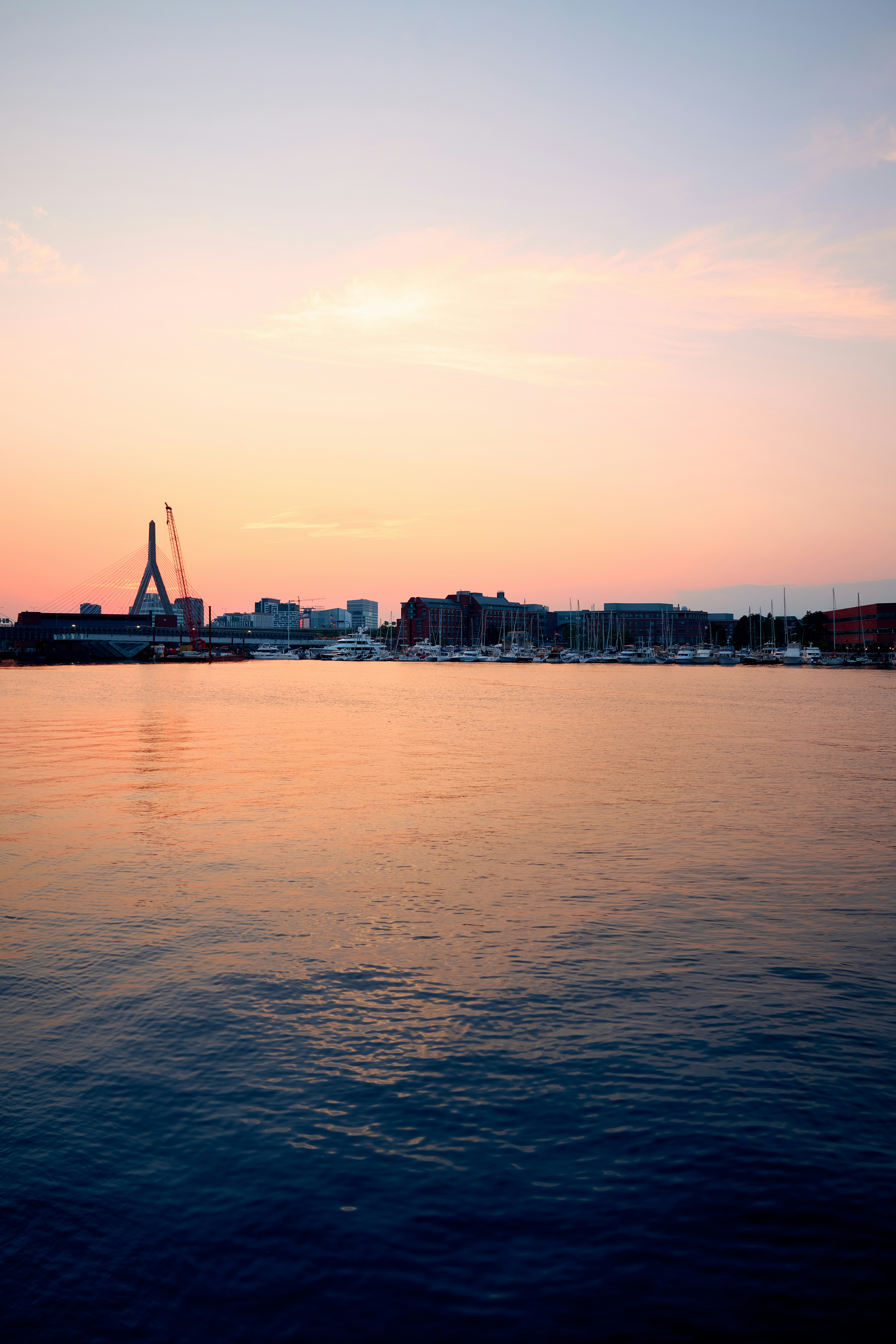 Dusk Over the Harbor: Pastel Light on Water and Boats