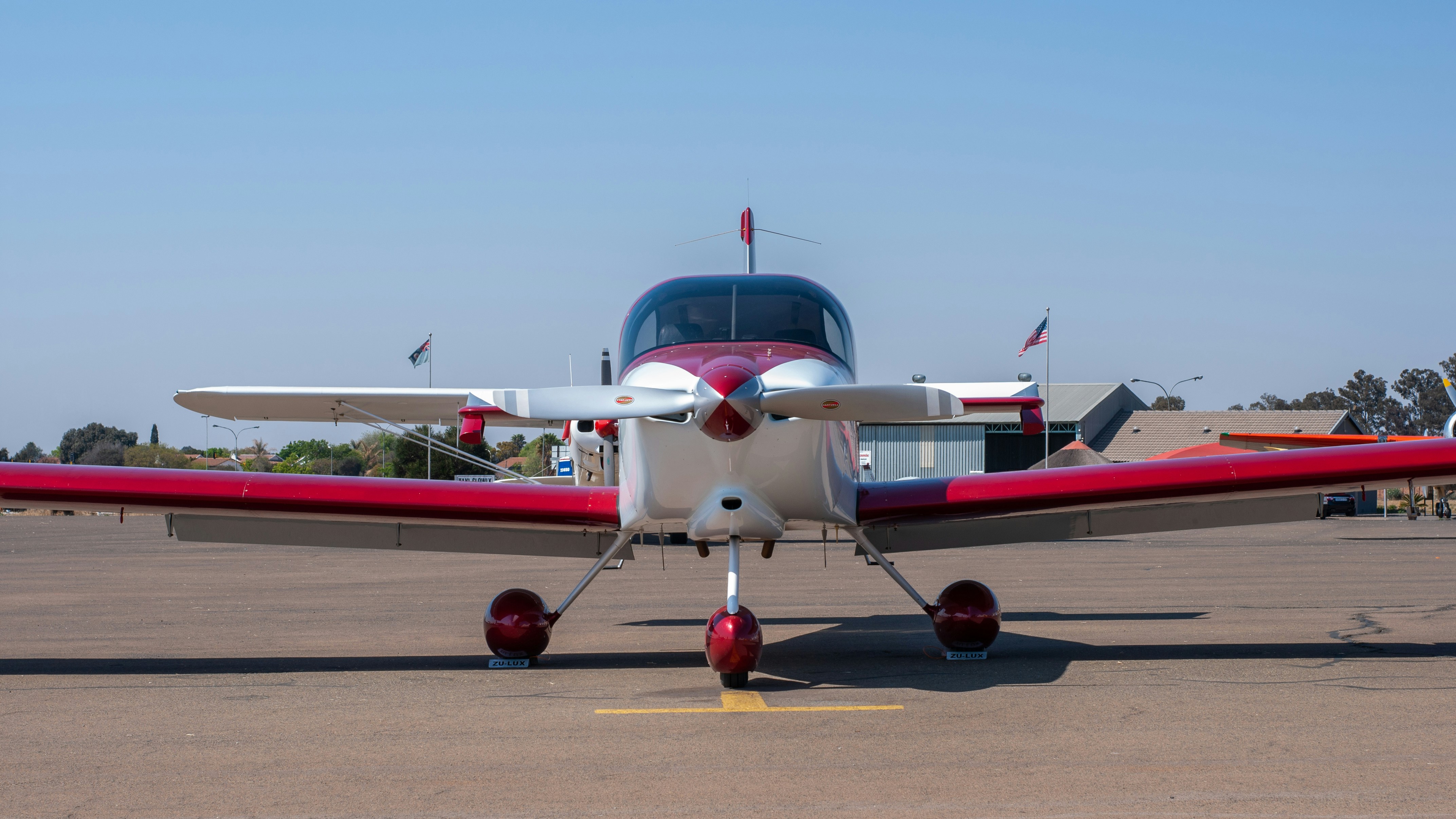 A small airplane sitting on top of an airport tarmac photo – Free ...
