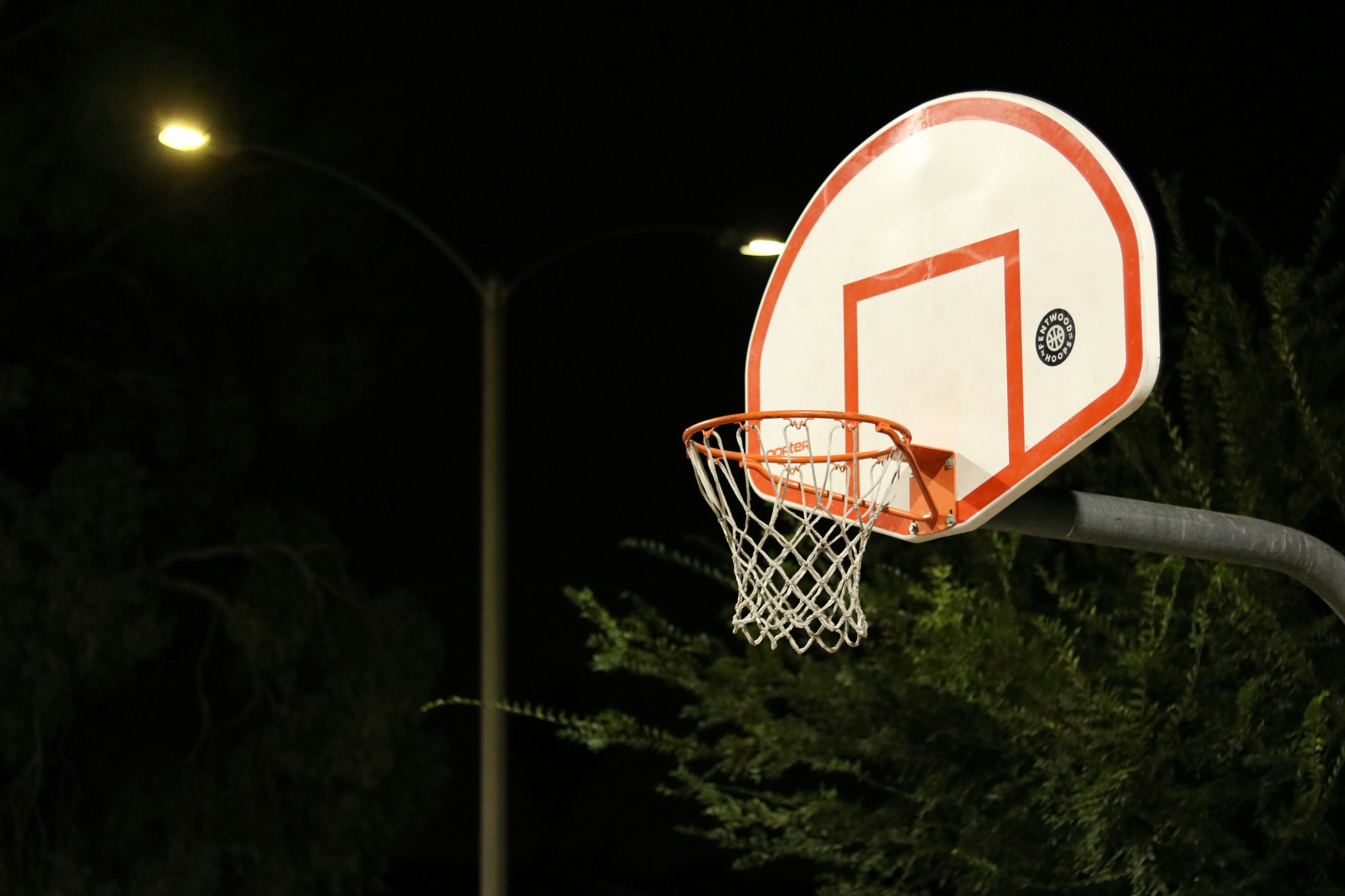 A basketball hoop with a basketball inside of it photo – Free Hoop ...