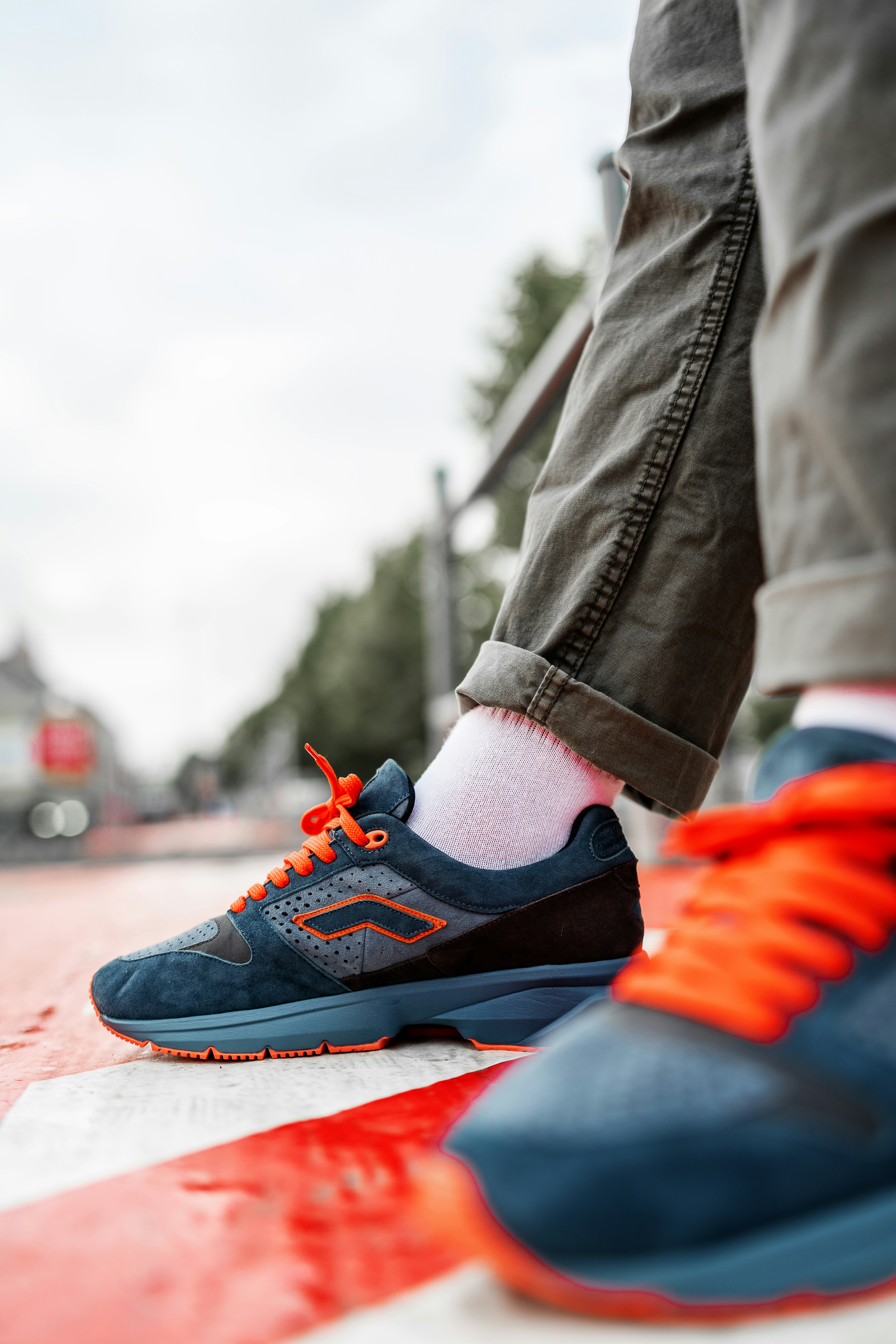 Neon laces on the running track: a close-up of motion