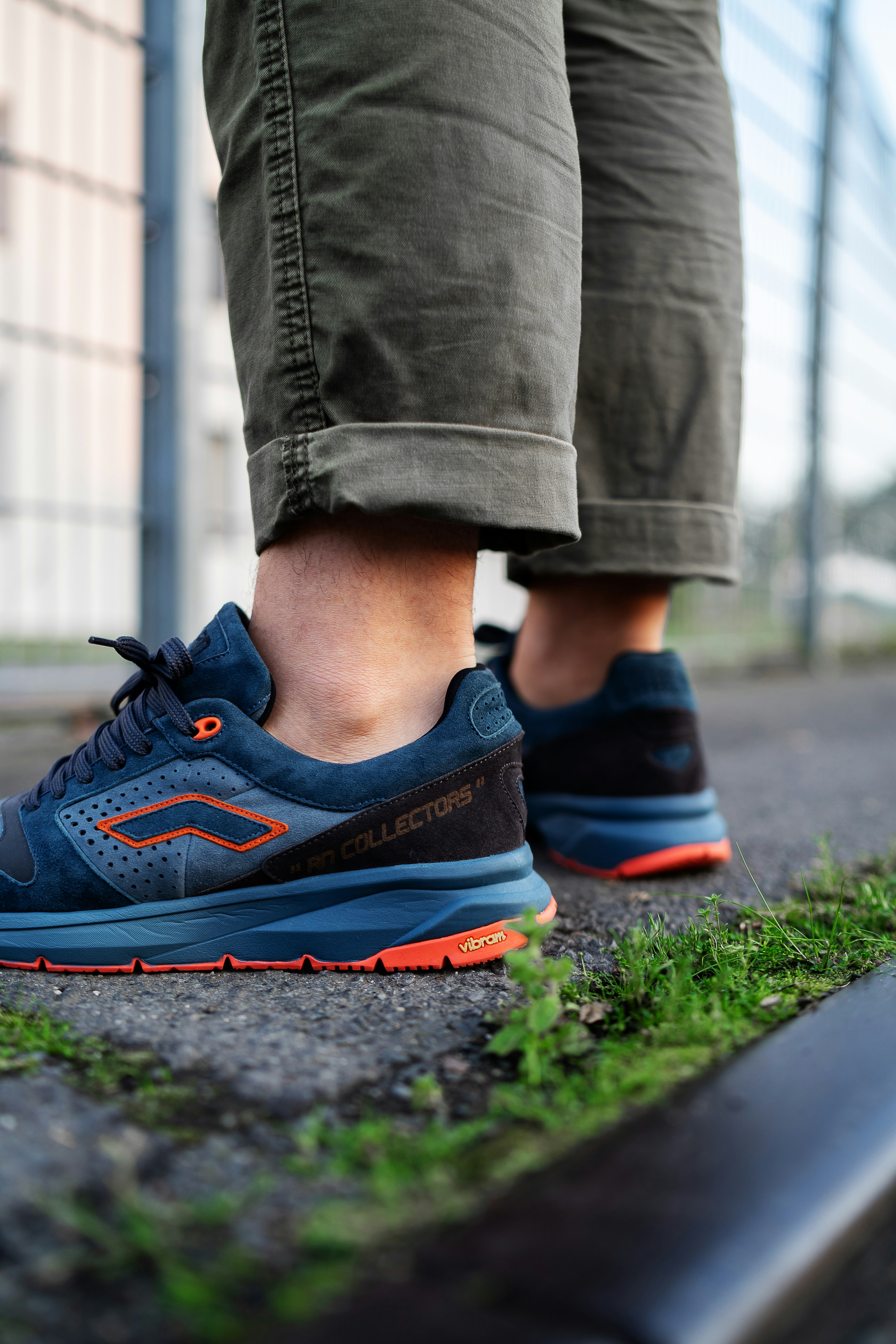 A close up of a person's shoes on the ground photo – Free Sneaker Image ...
