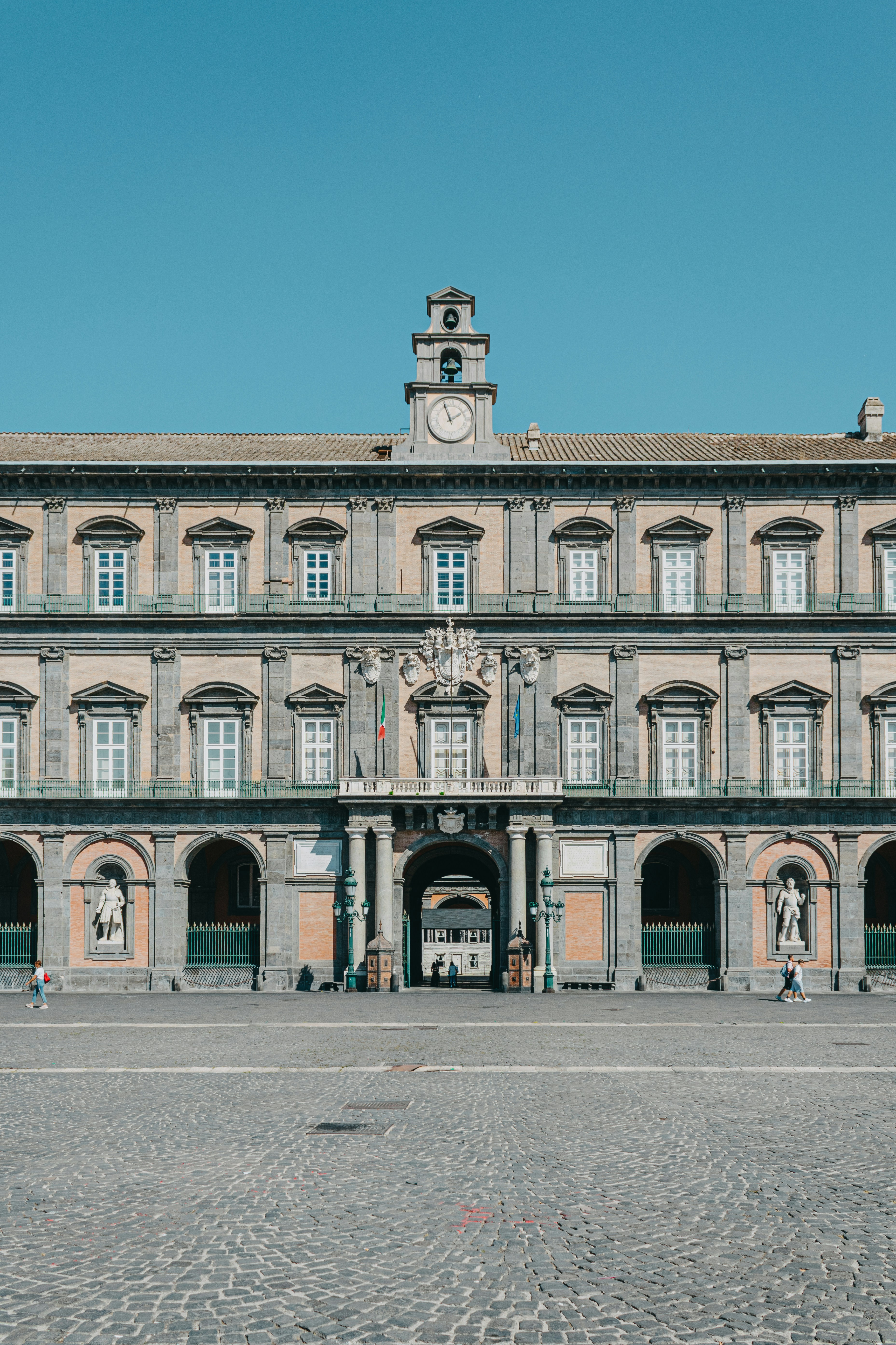 A large building with a clock tower on top of it photo – Free Palazzo ...