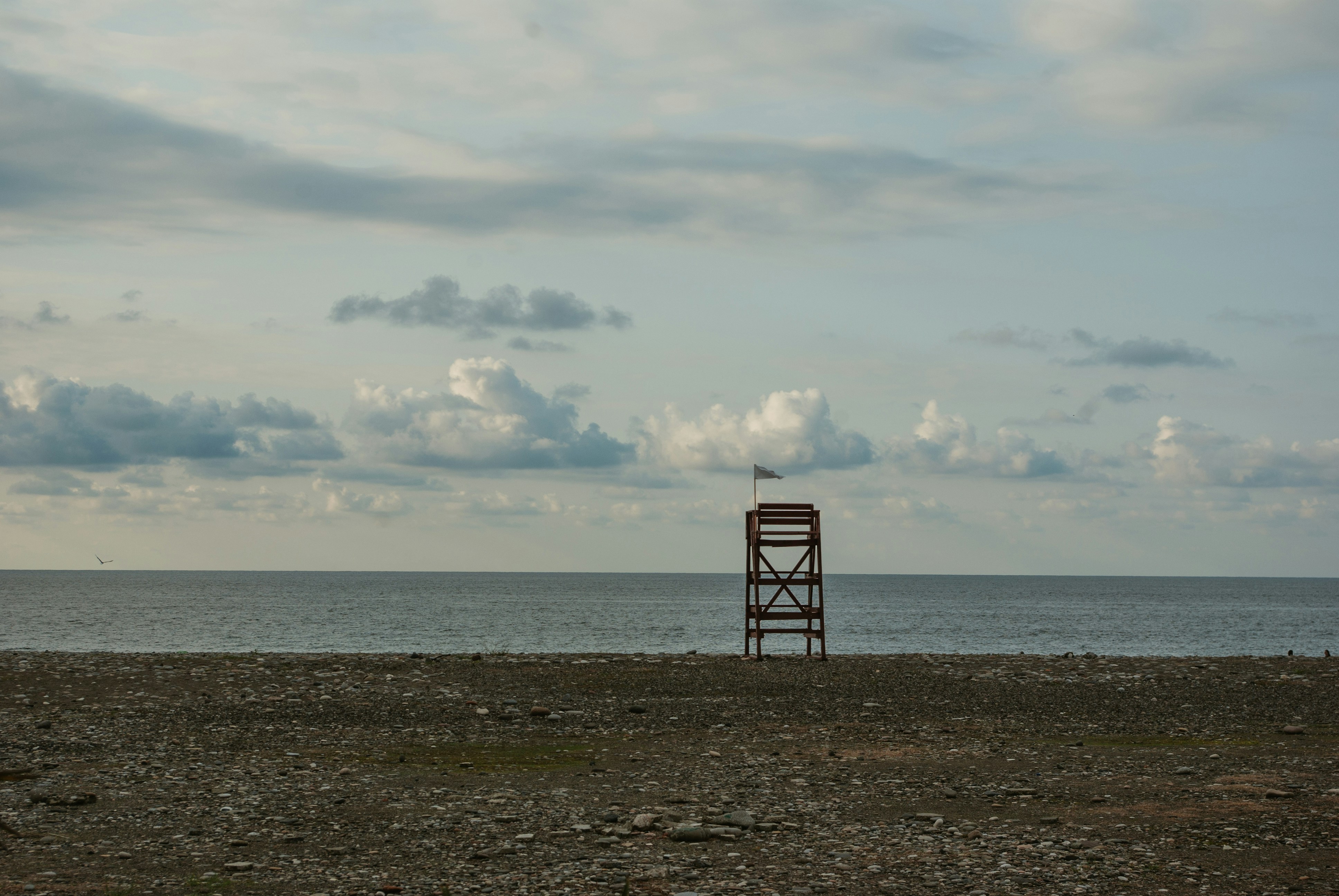 Lifeguard Tower on a Quiet Pebble Beach at Dusk