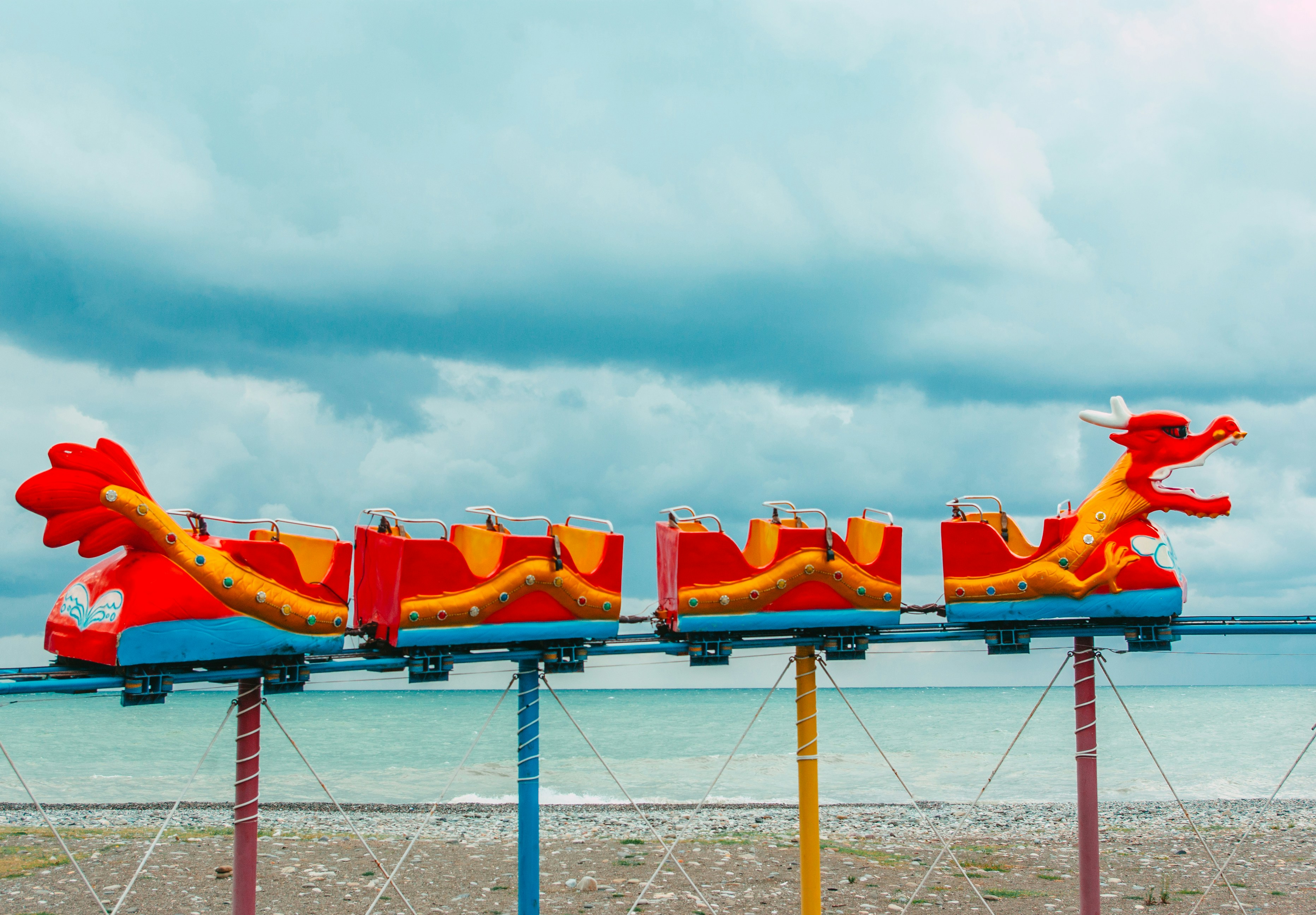 Dragon boat ride over the sea: color, motion, and beachy calm