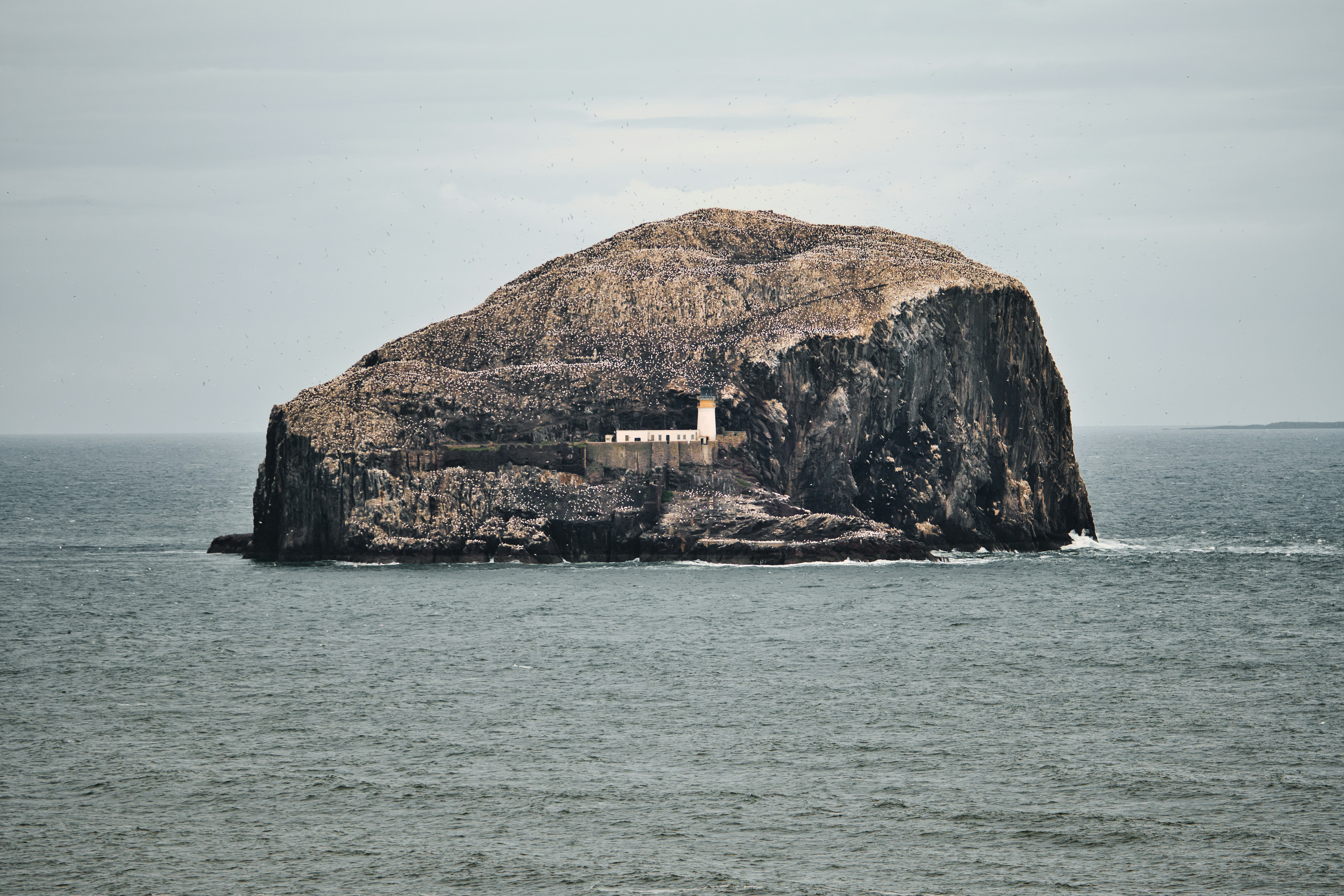 Lone Bastion on Granite Isle Against a Quiet Sea