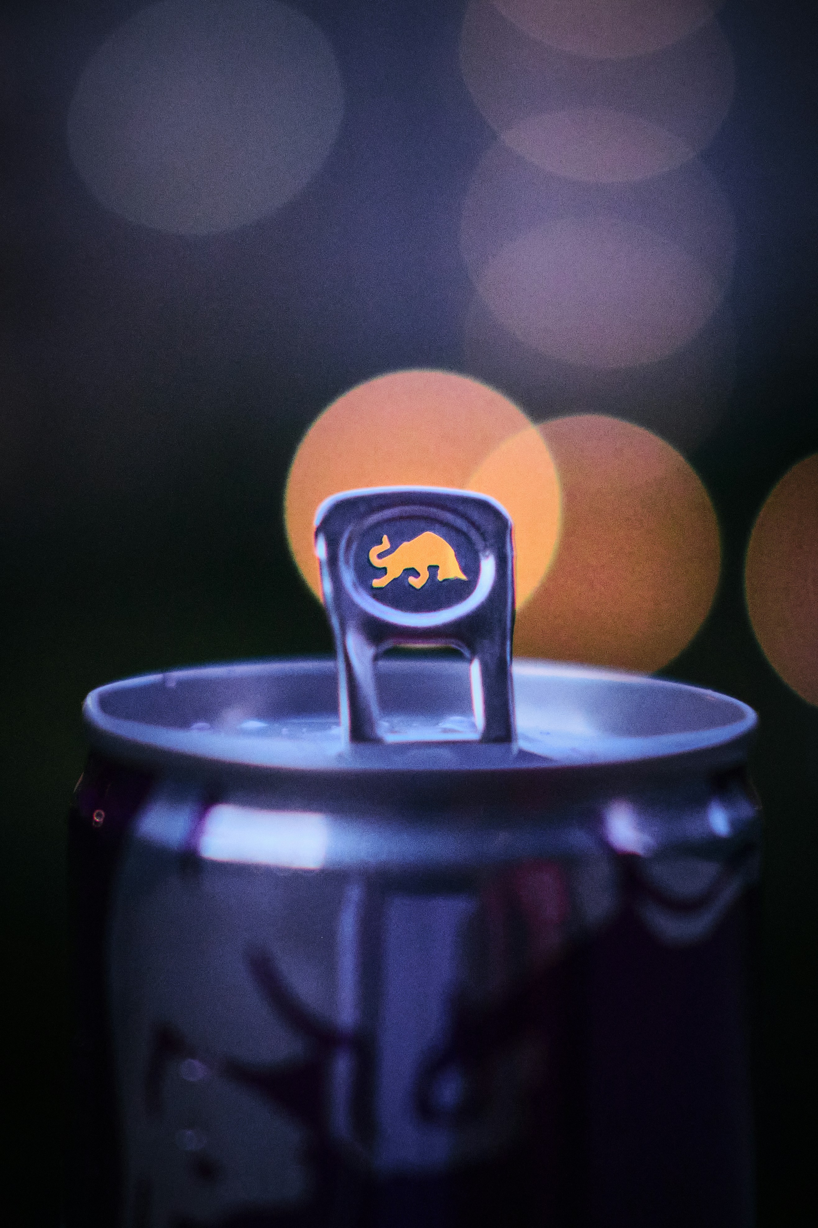 Tiger Logo on a Soda Tab: Quiet Focus Amid City Lights