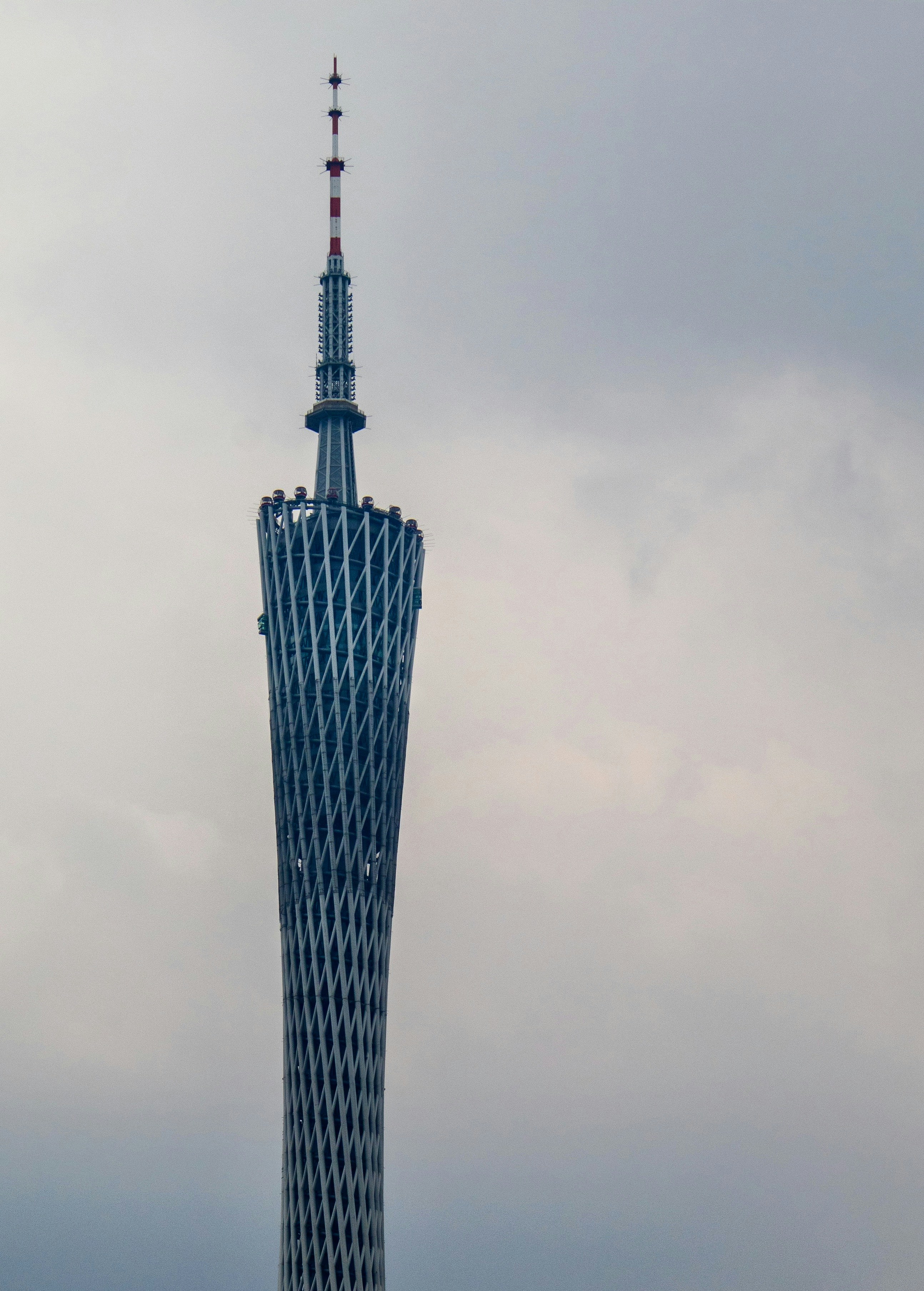 Lattice Spire at Dusk: Canton Tower Rising Against a Pale Sky