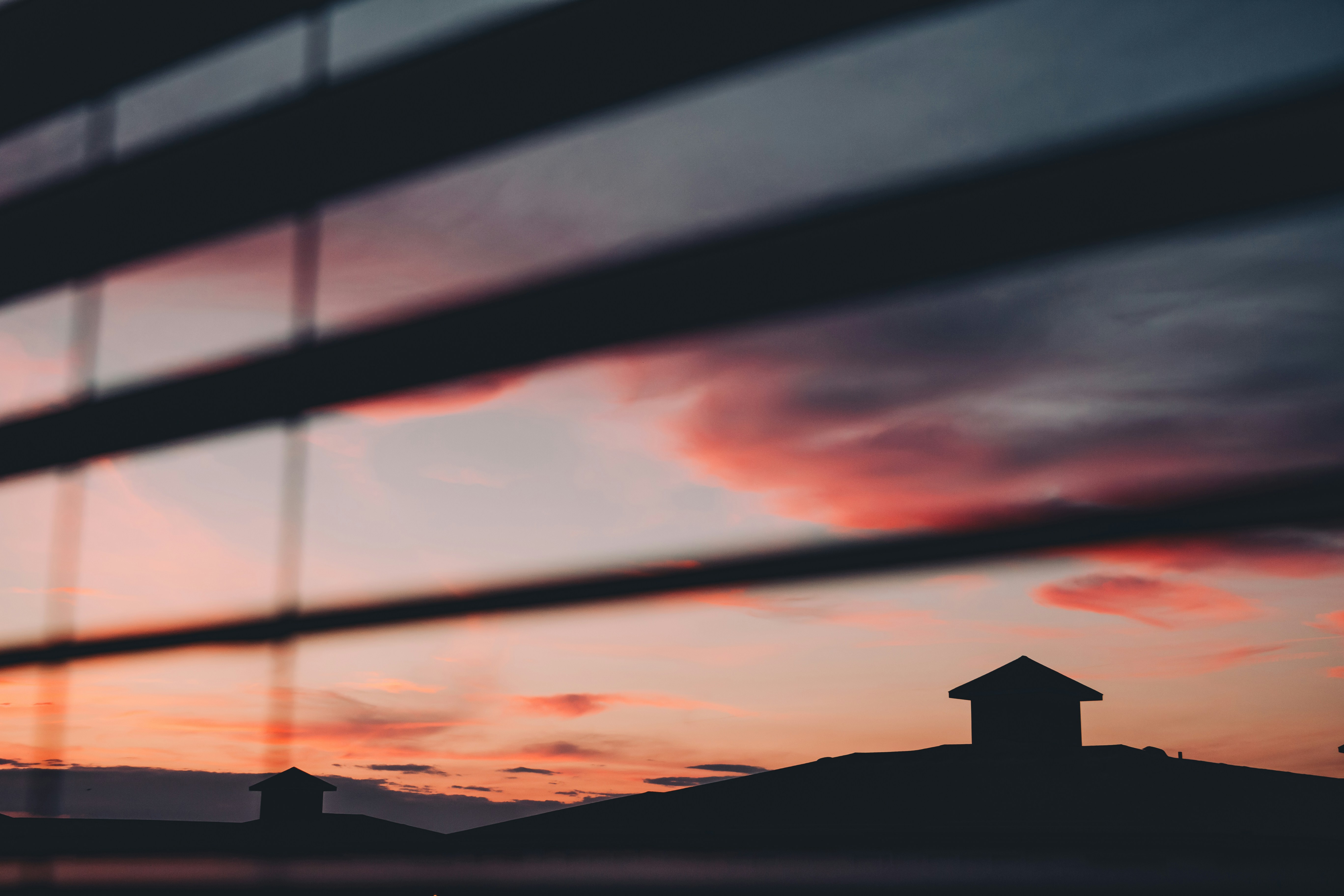 A view of a sunset through a window photo – Free Window Image on Unsplash