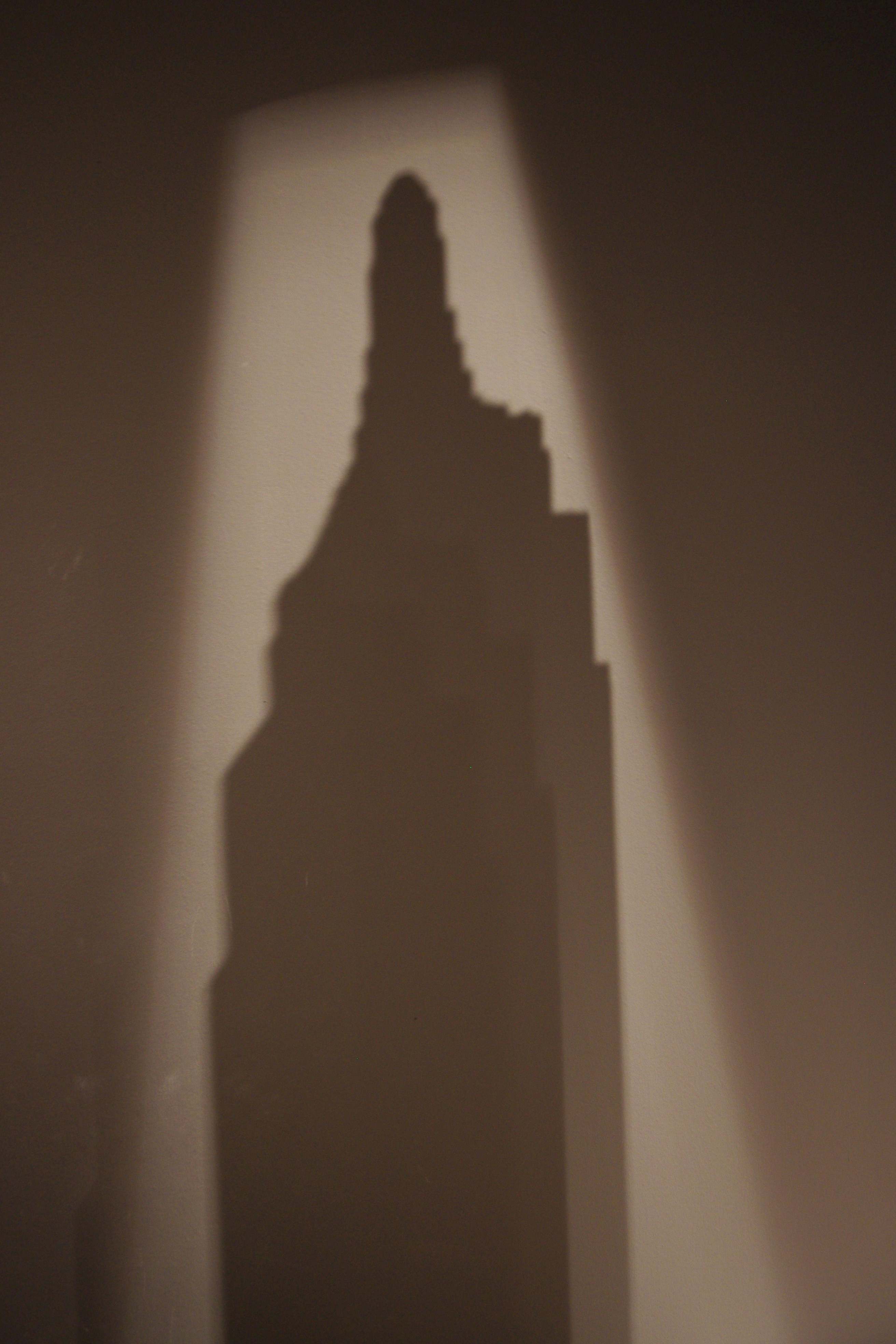 A shadow of a building on a wall photo – Free Shadow Image on Unsplash