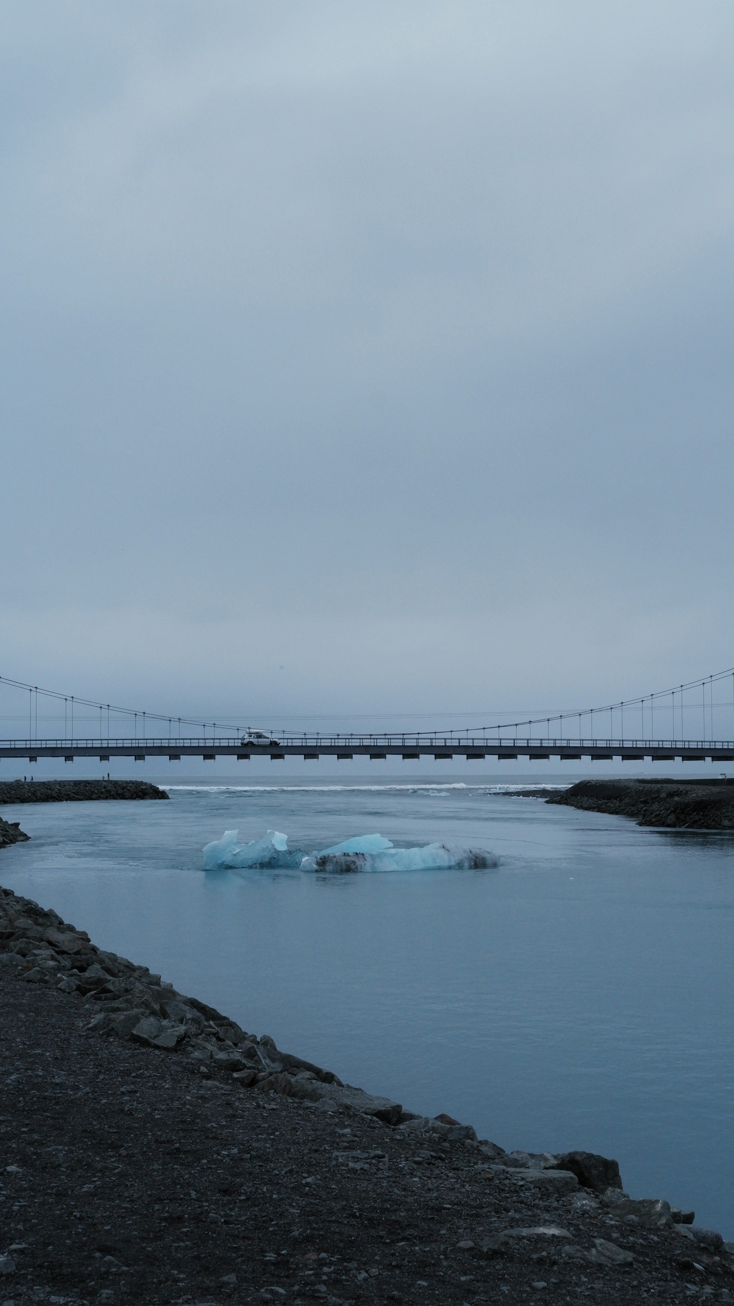 Icy Crossing: A Quiet Arctic Bridge over a Frozen Inlet
