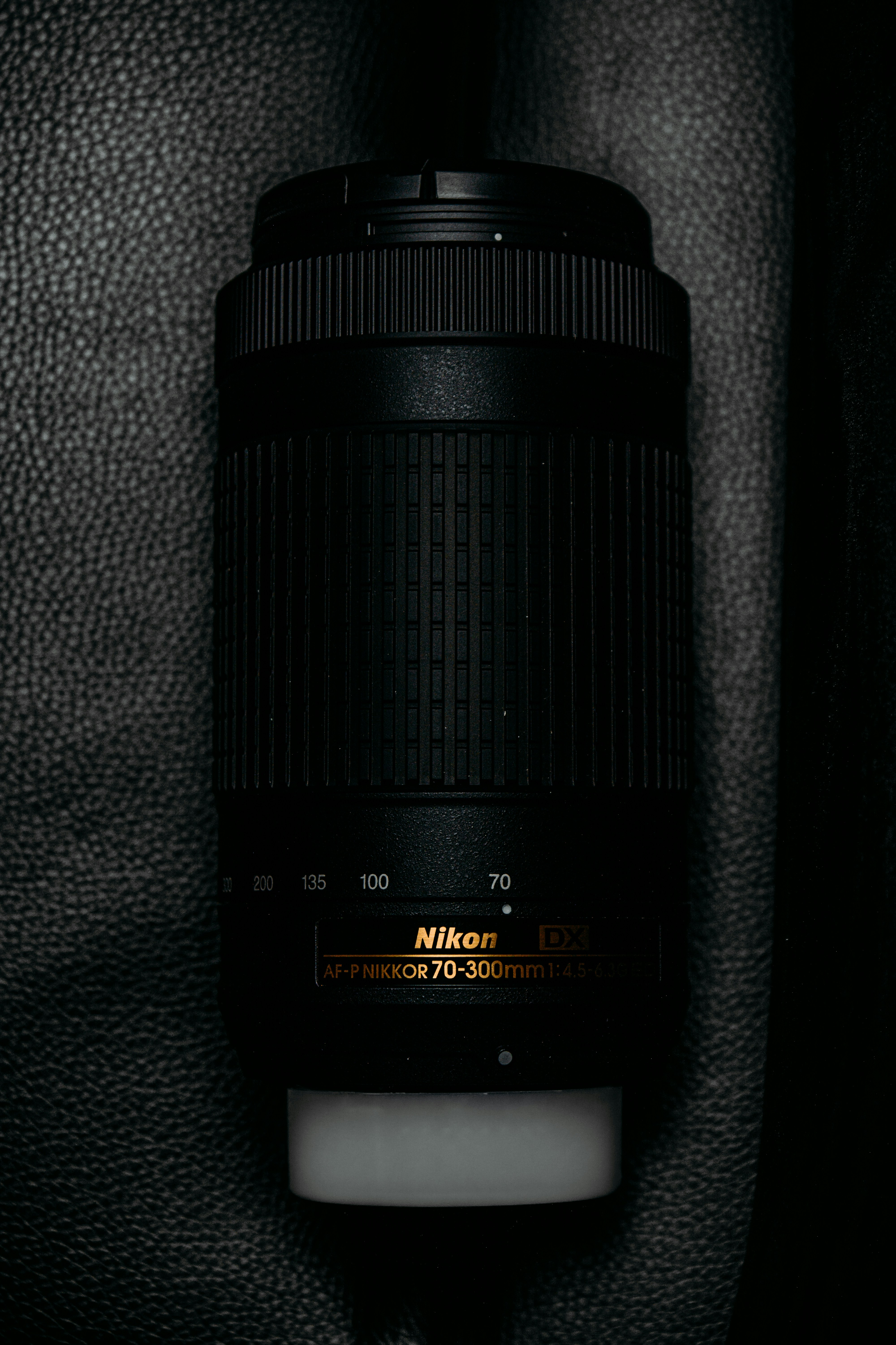 a close up of a camera lens on a black background