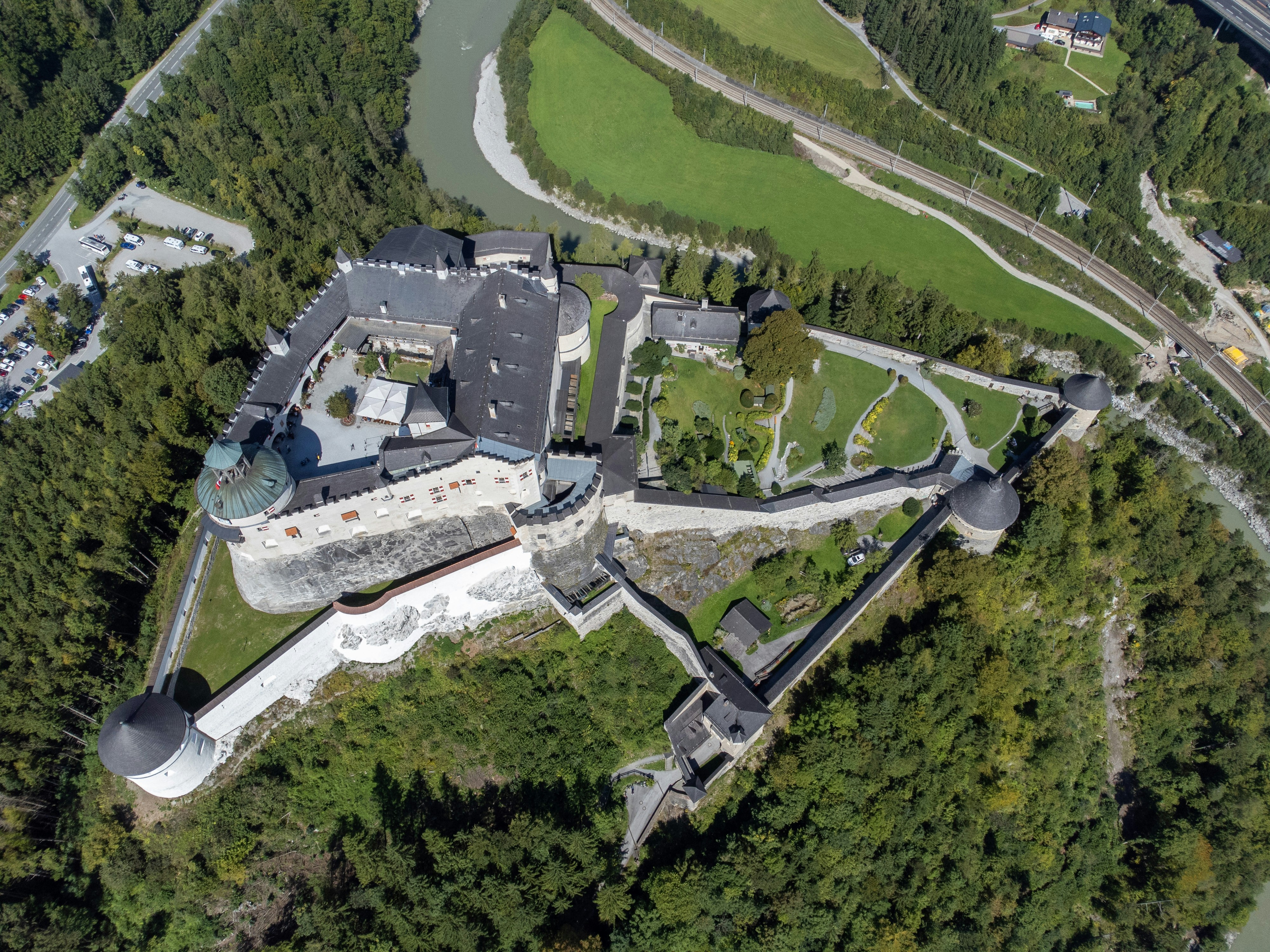 An aerial view of a castle surrounded by trees photo – Free Landscape ...