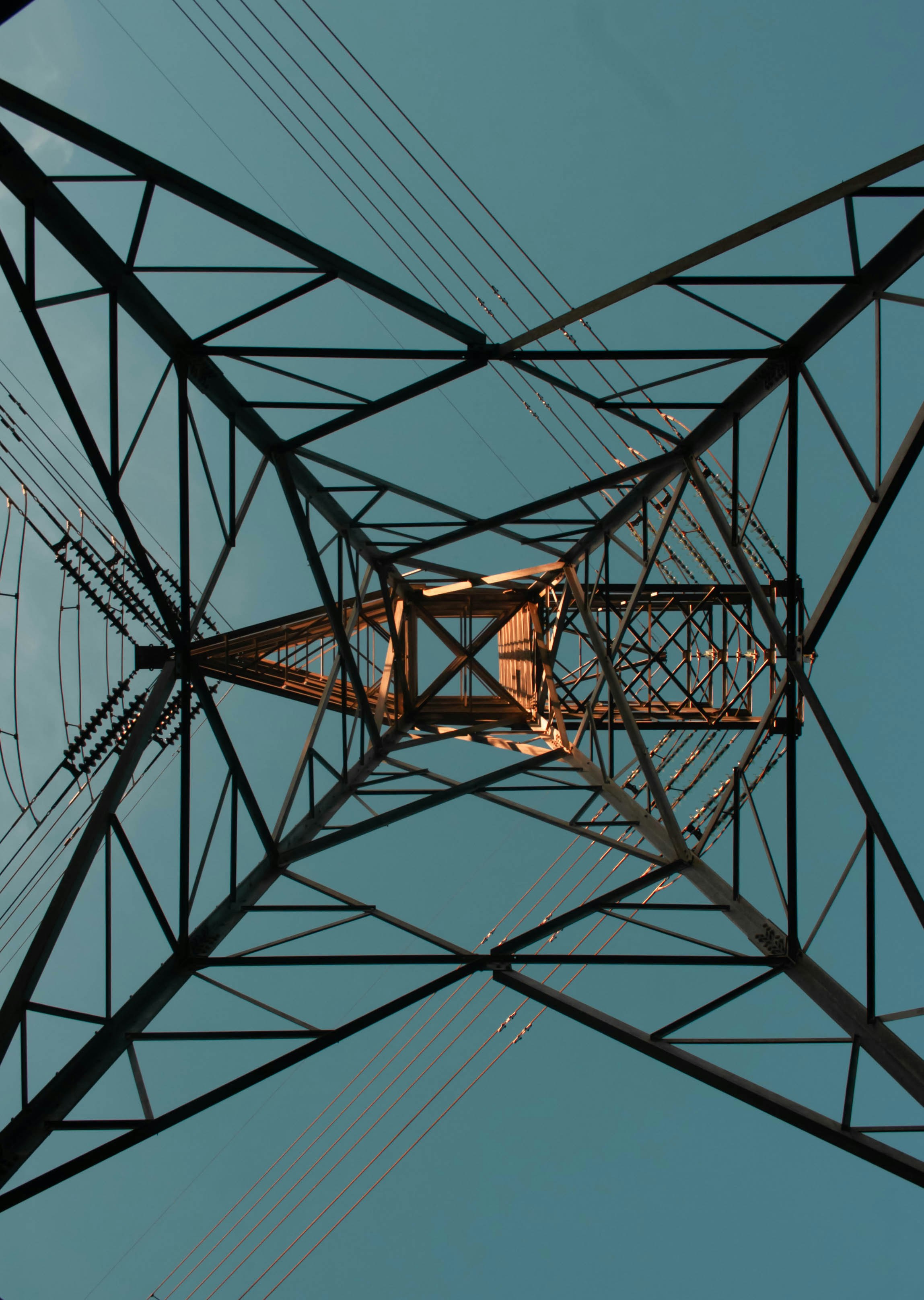 An overhead view of a power line with a blue sky in the background ...