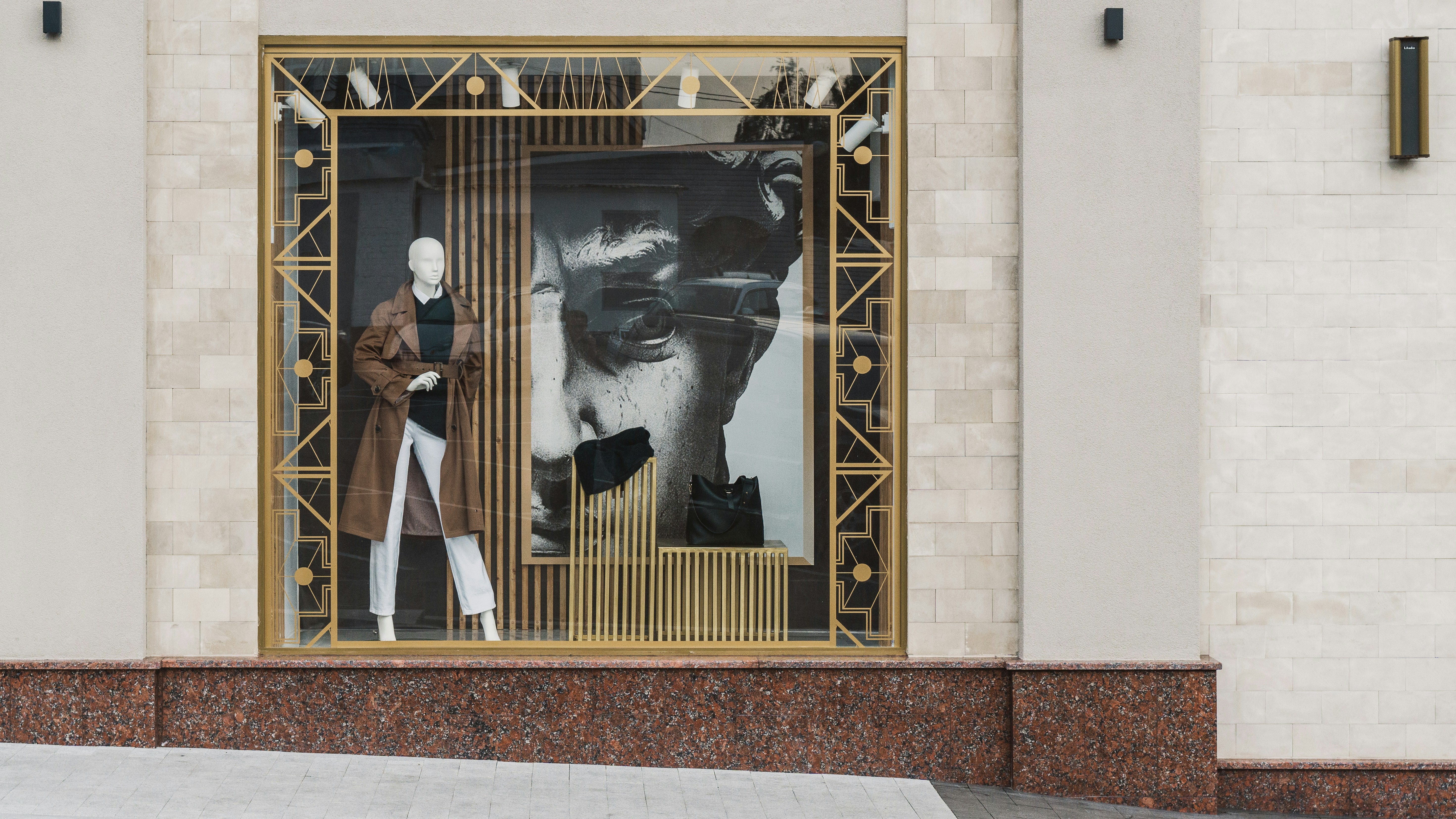 a man standing in front of a store window