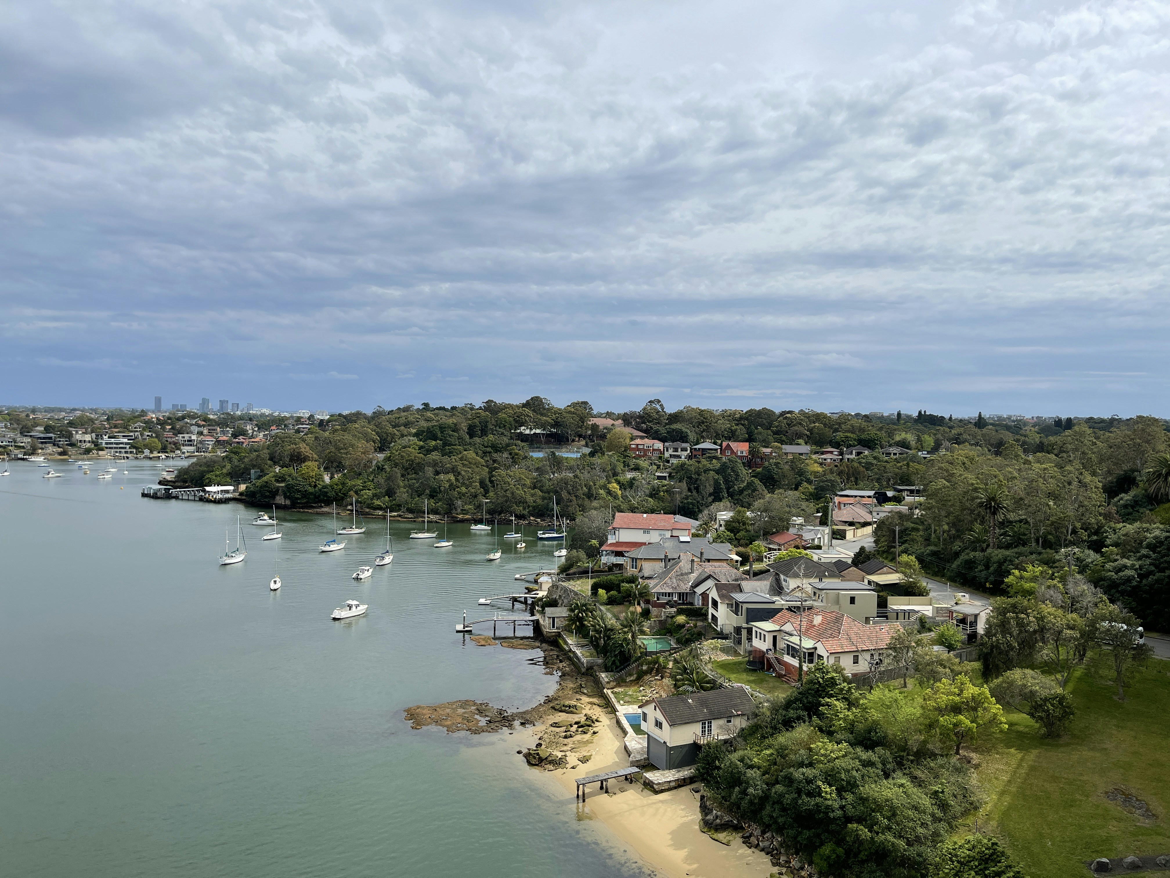 Coastal Village shoreline with boats and calm waters