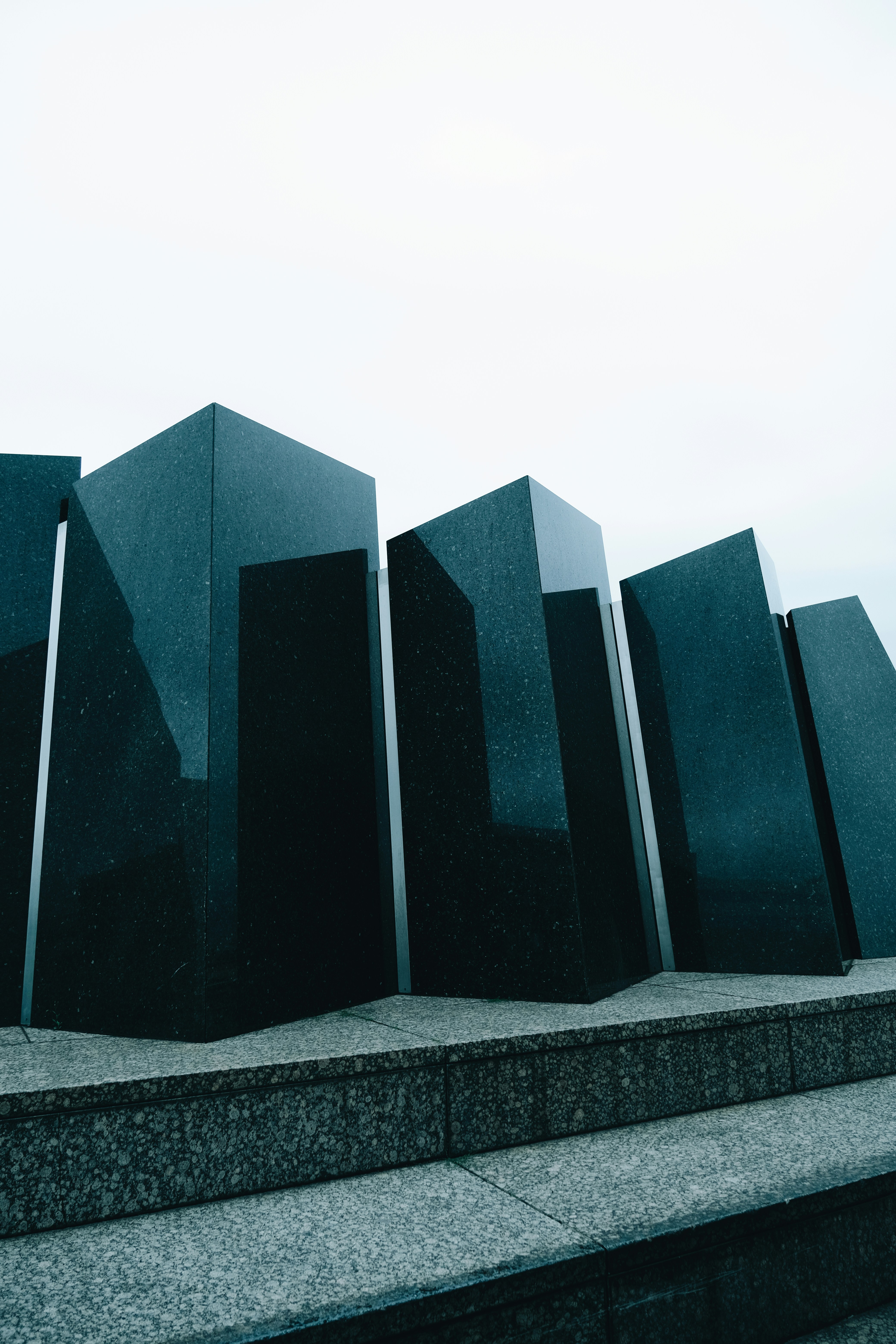 Faceted Glass Spires Along a Granite Ledge