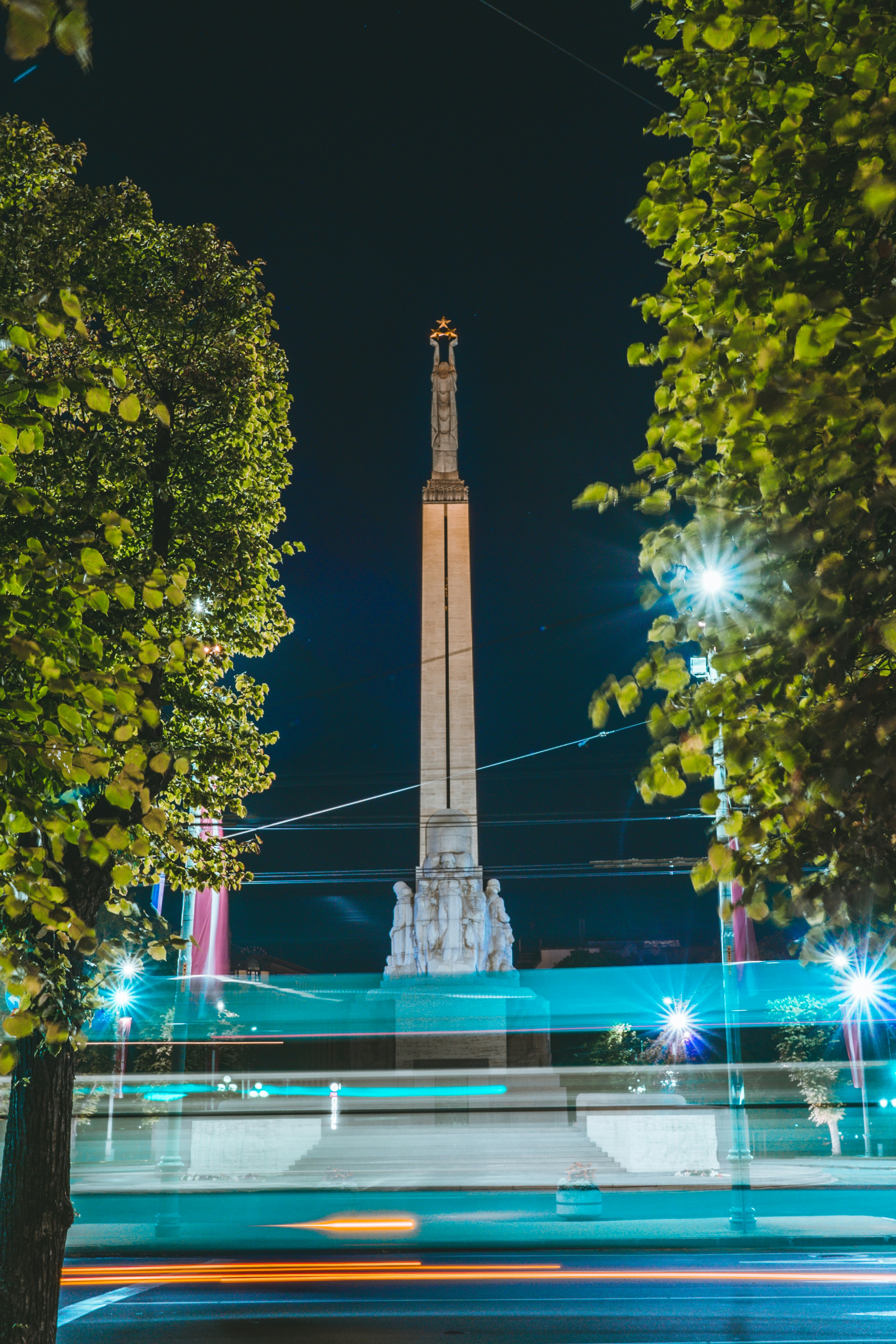 a tall monument with a cross on top of it