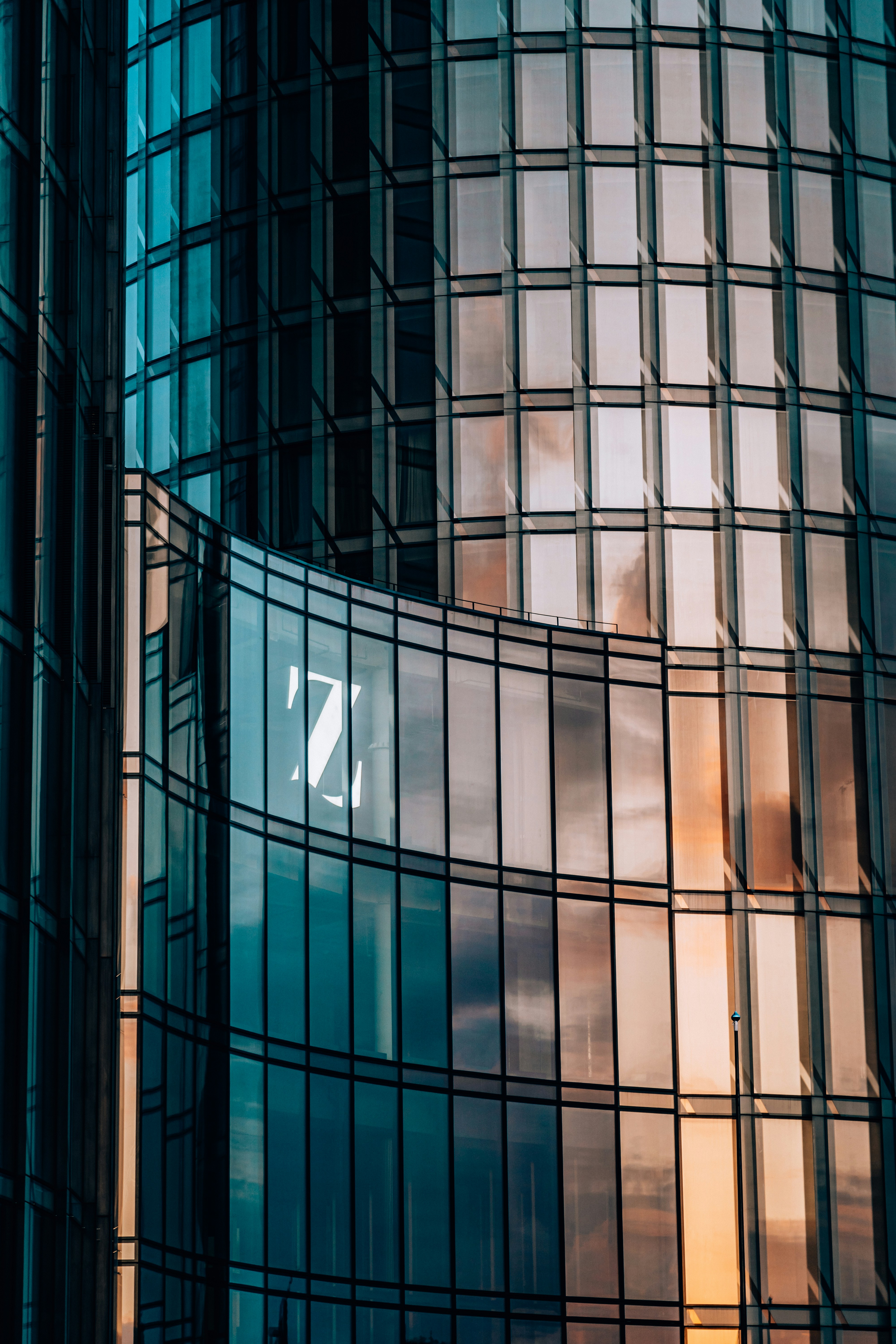 Reflections in Curved Glass: An Abstract Facade