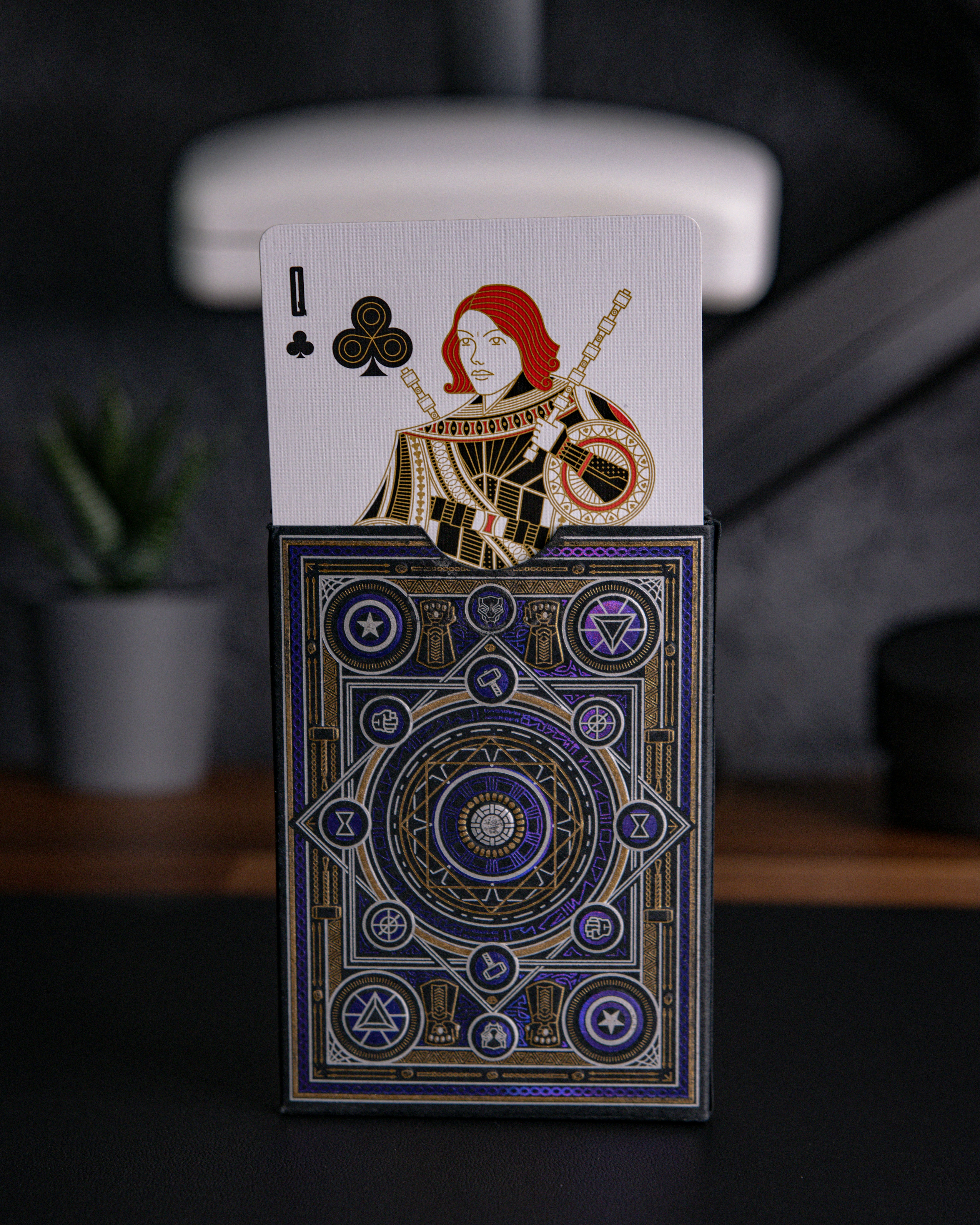 Queen Unfolds: Regal Portrait Above a Geometric Card Back